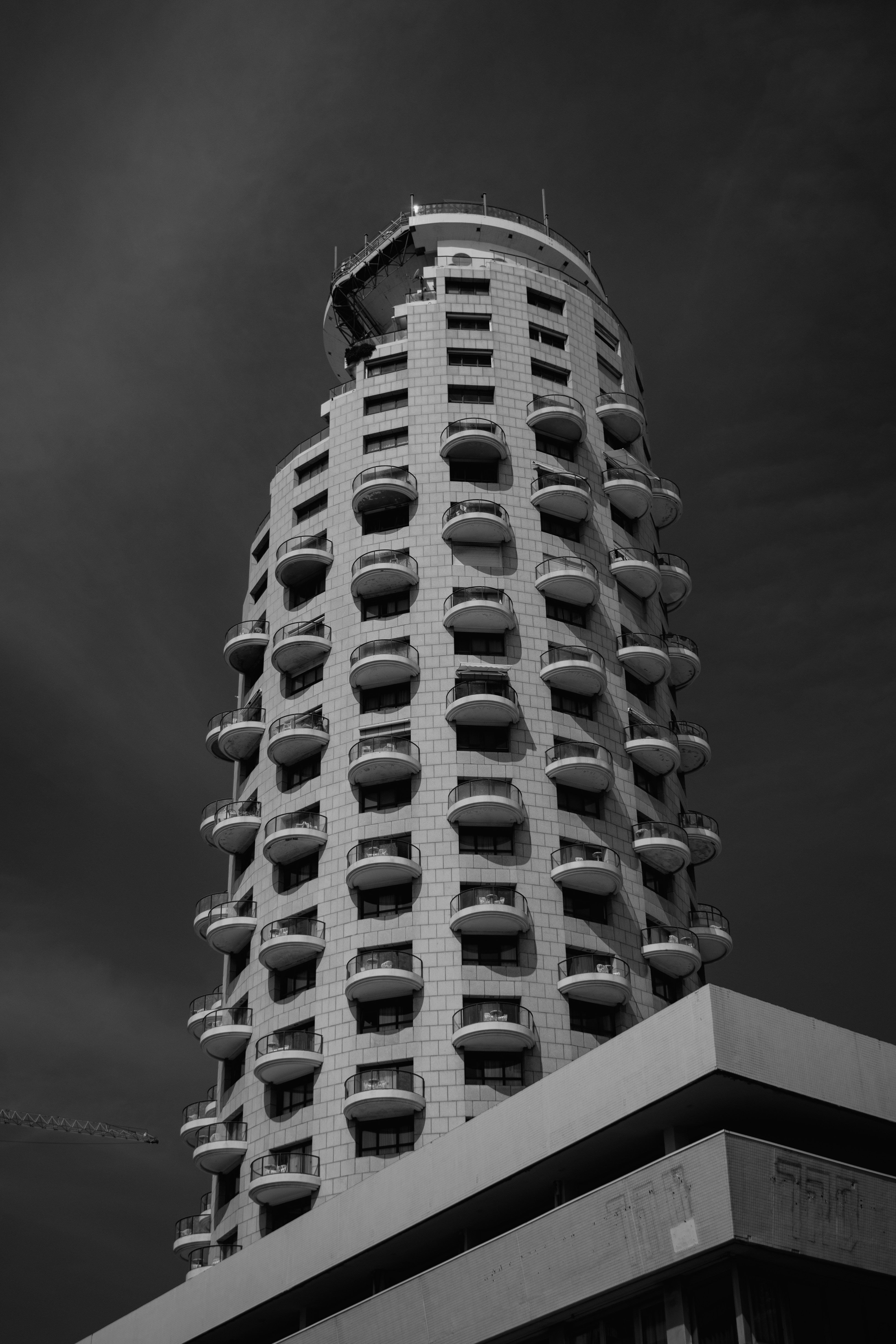 Balconied Obelisk: A Monochrome Tower Reaching the Sky