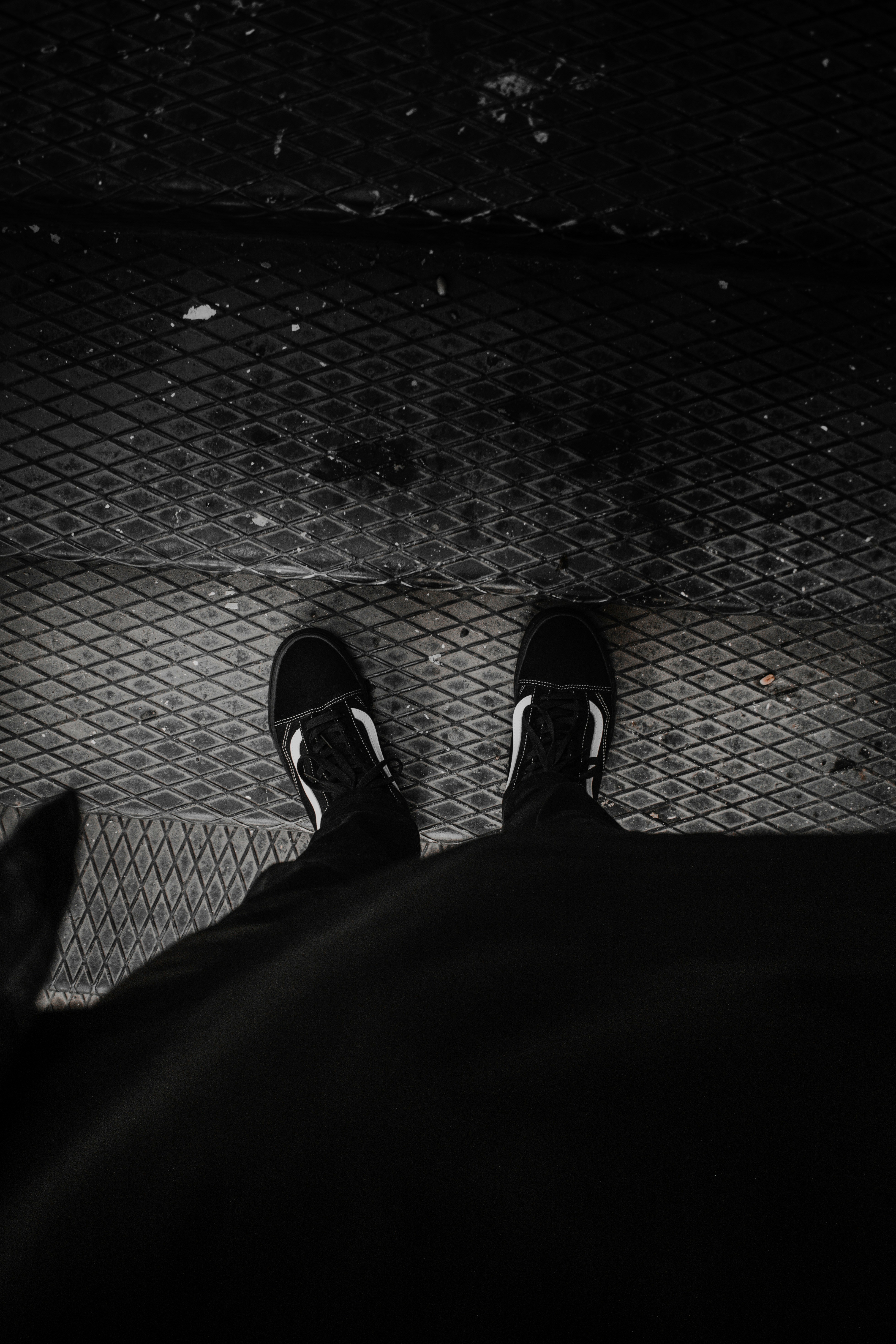 A person with their feet up on the ground photo – Free Shoe Image on ...