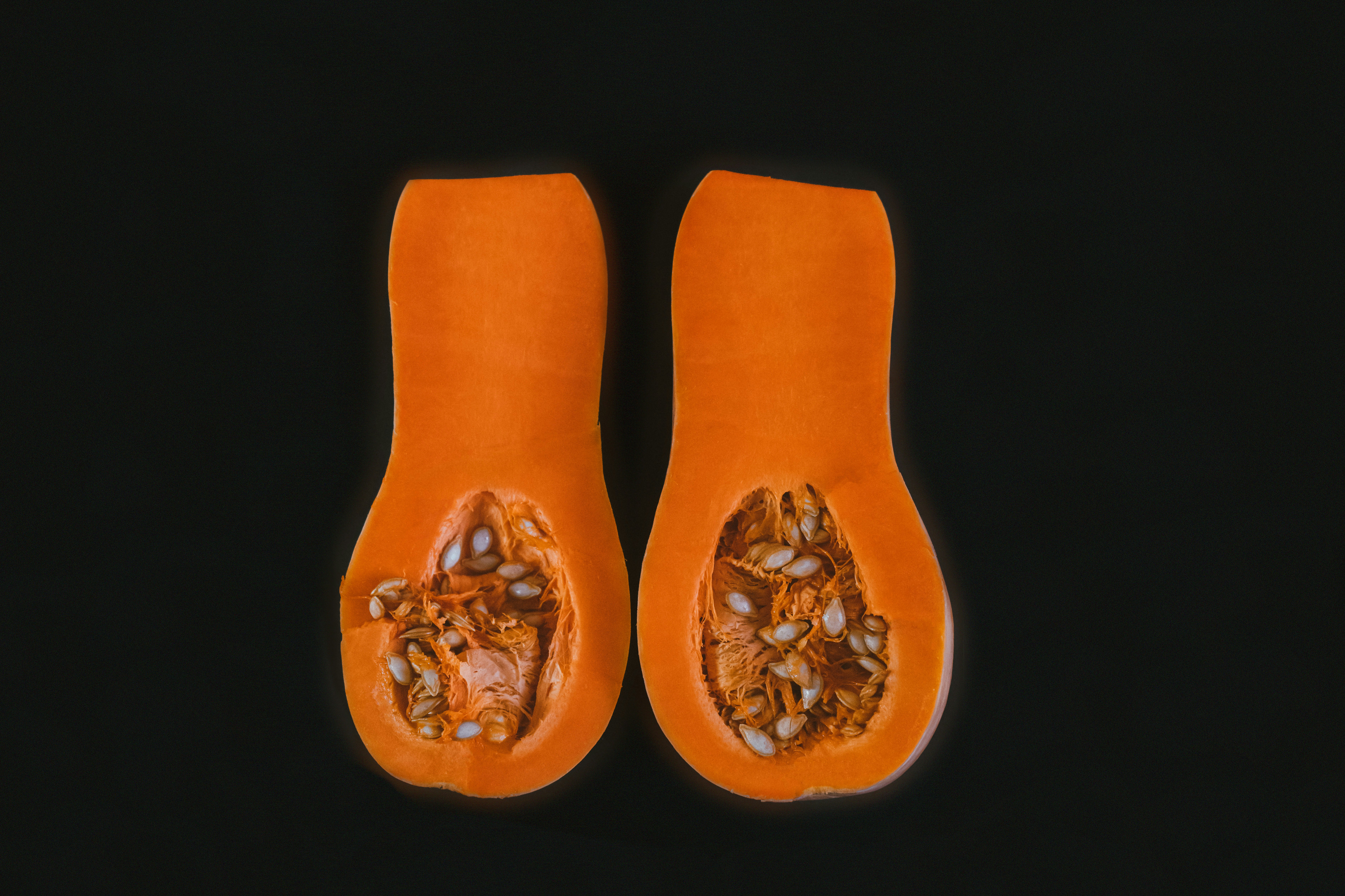 a couple of pieces of pumpkin sitting on top of a table