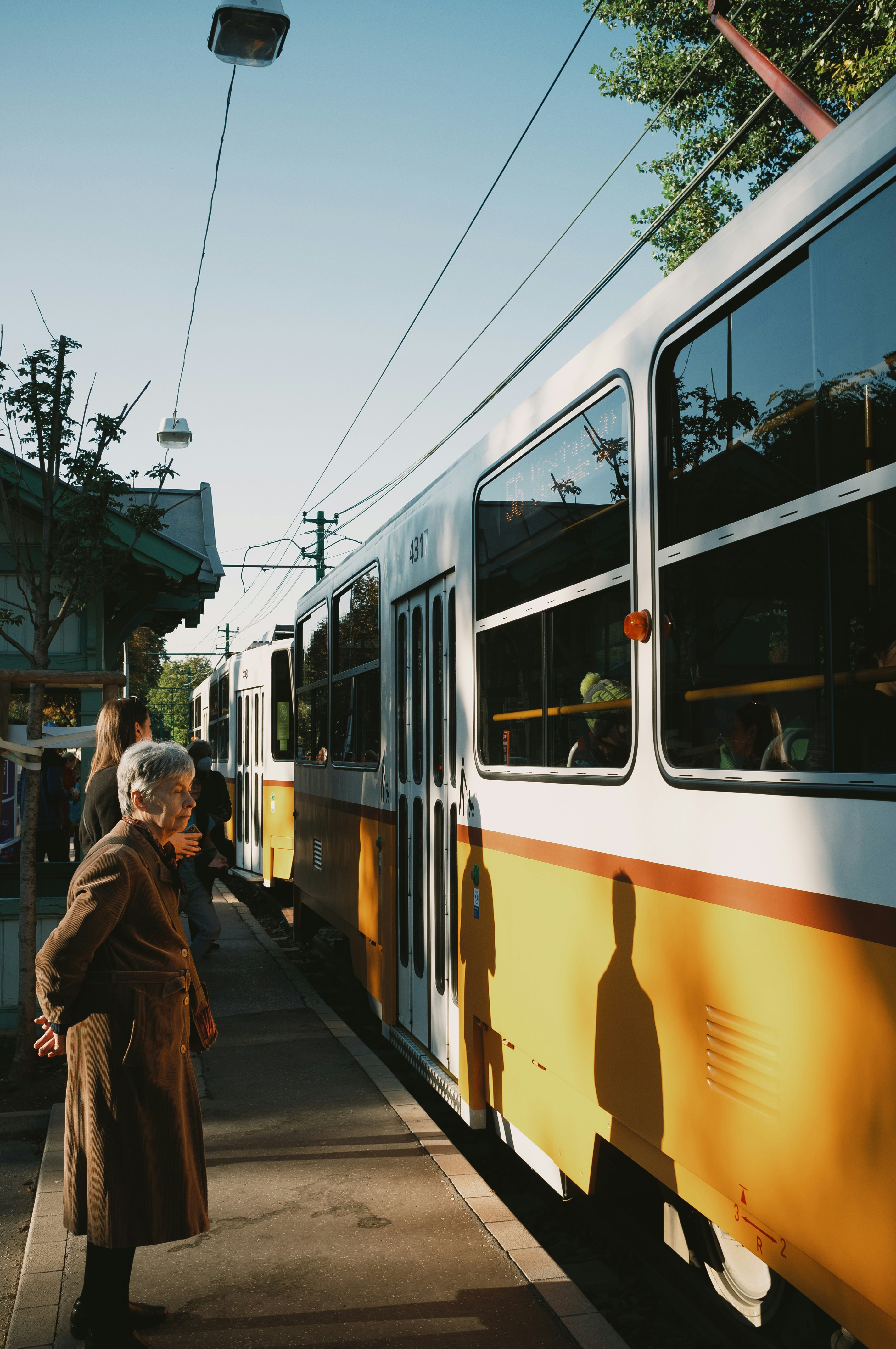 Platform Scene: Commuter and Train in Warm Evening Light