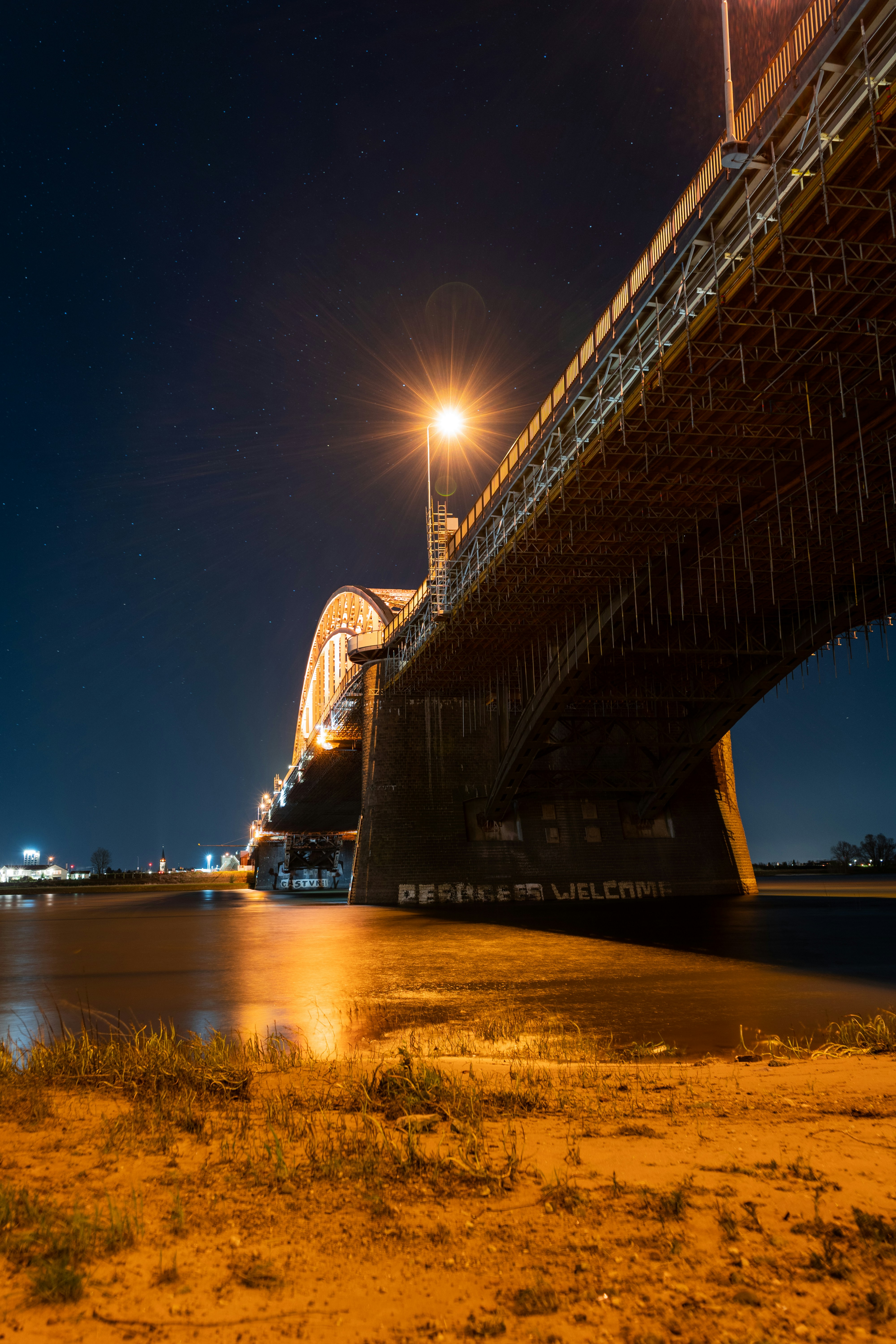 a bridge over a body of water at night