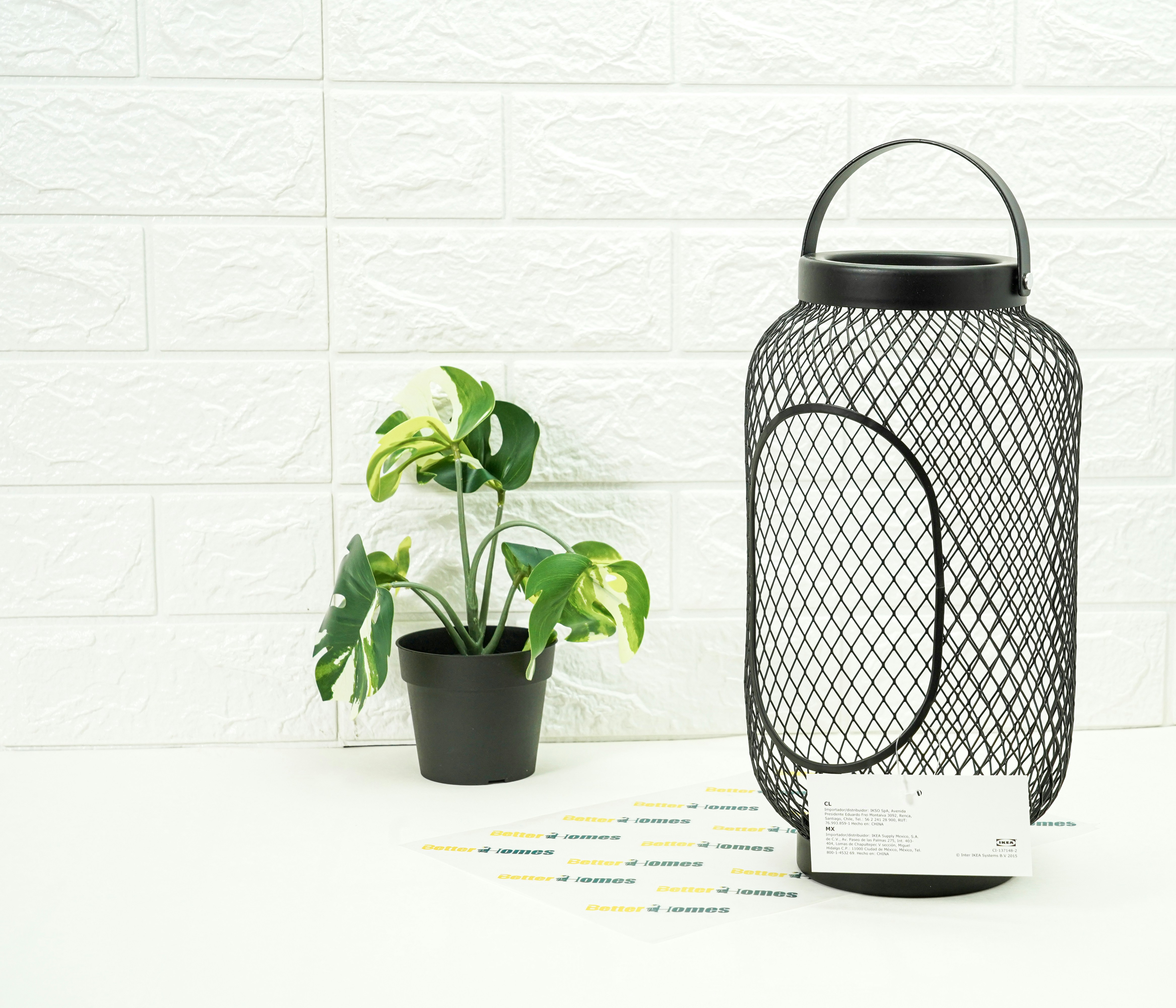 Luminous Mesh Lantern Anchors a Quiet Desktop Still Life
