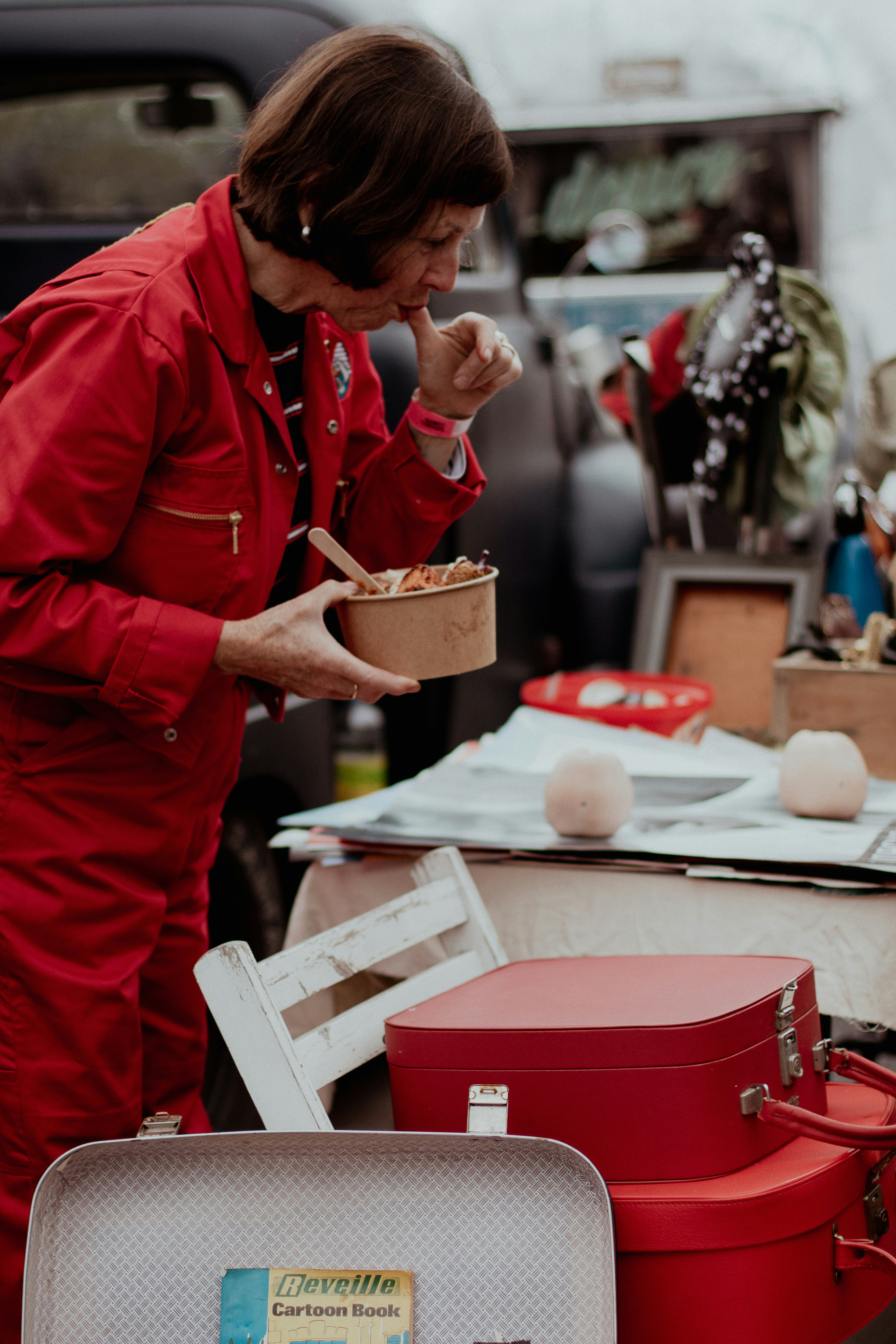 Red Jacket Snack Stop at a Quiet Street Market