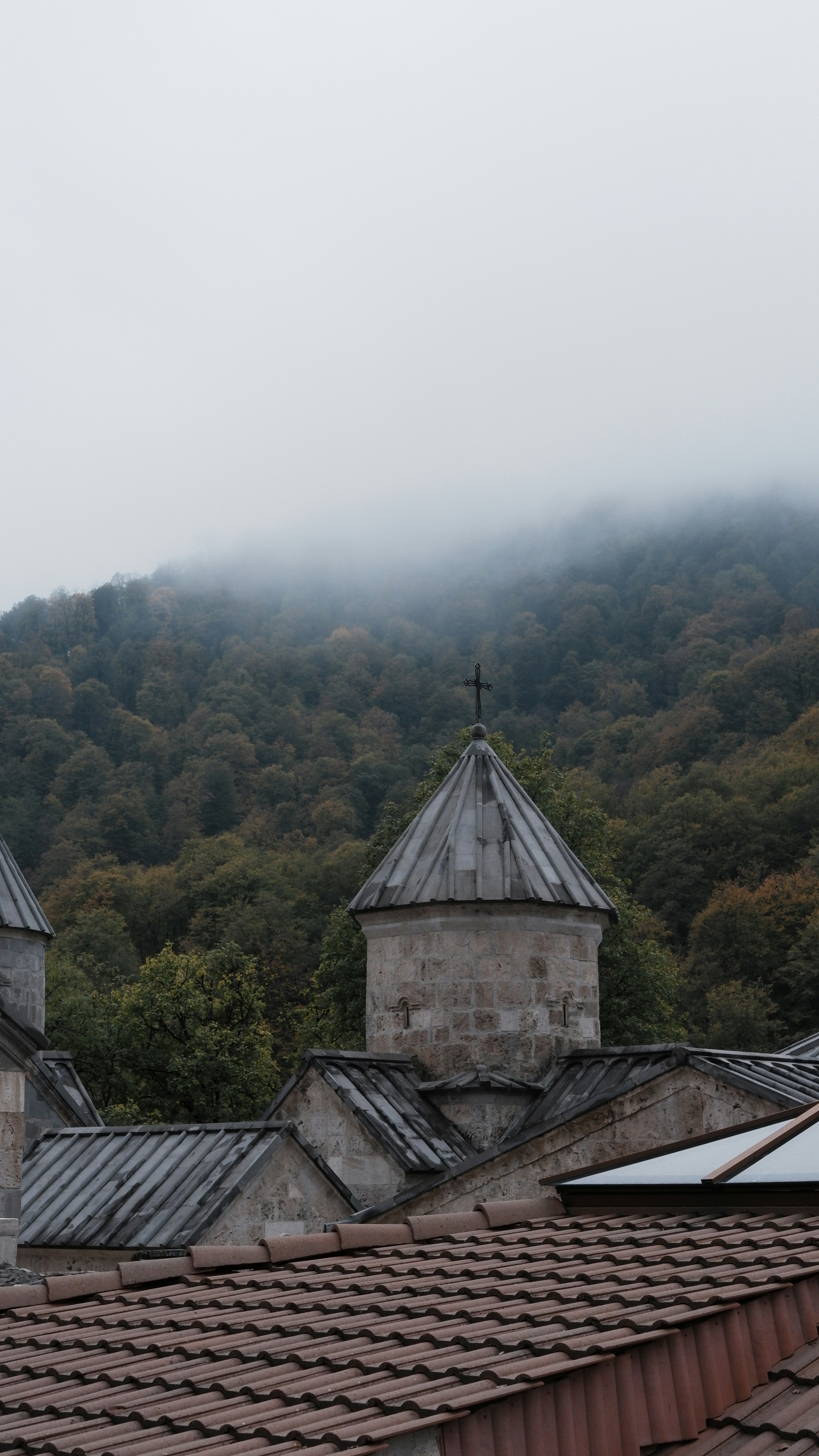 Conical Turret and Red Tile Roofs Veiled by Morning Fog
