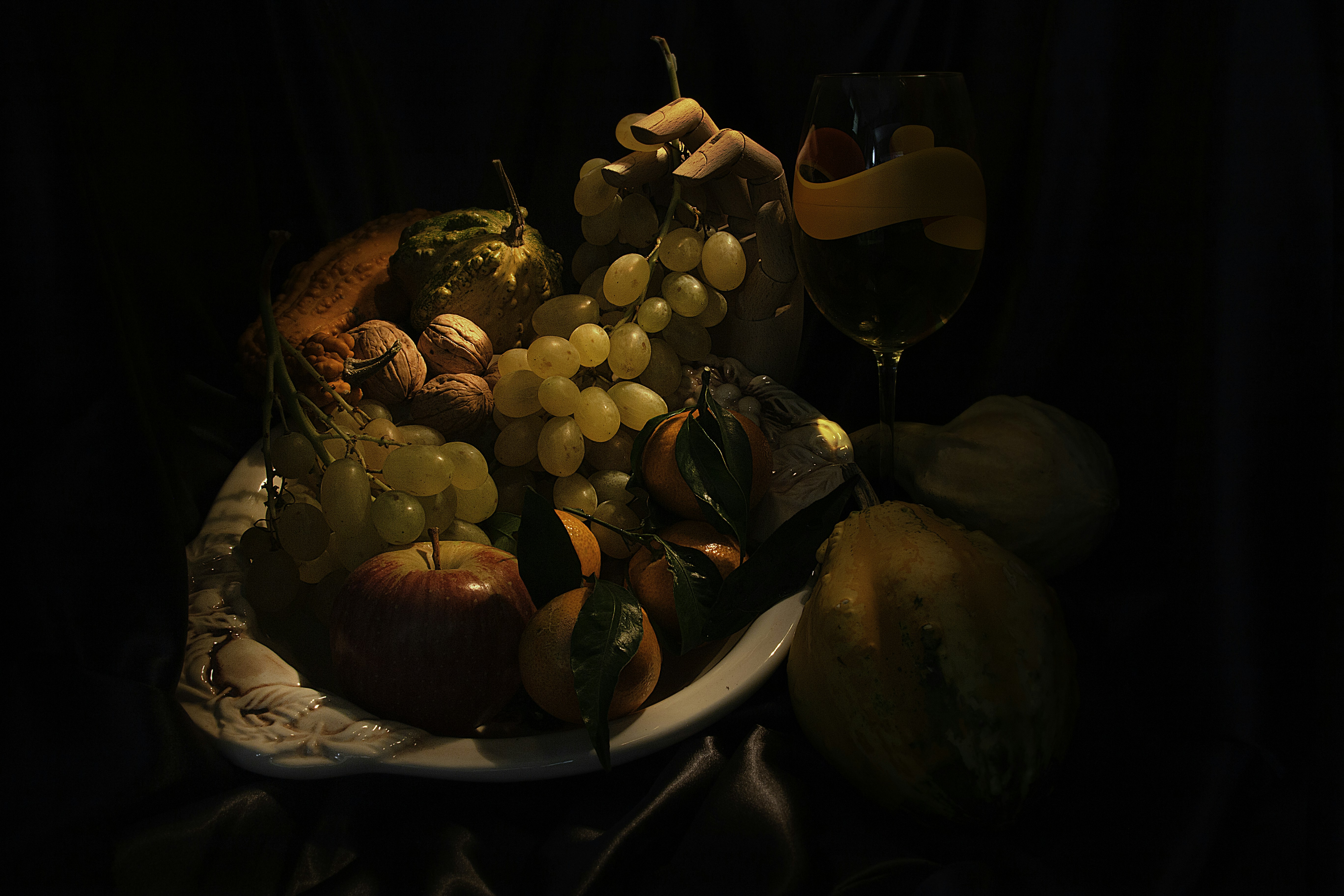 Velvet Shadow Still Life: Harvest on a Plate with Grapes and Glass