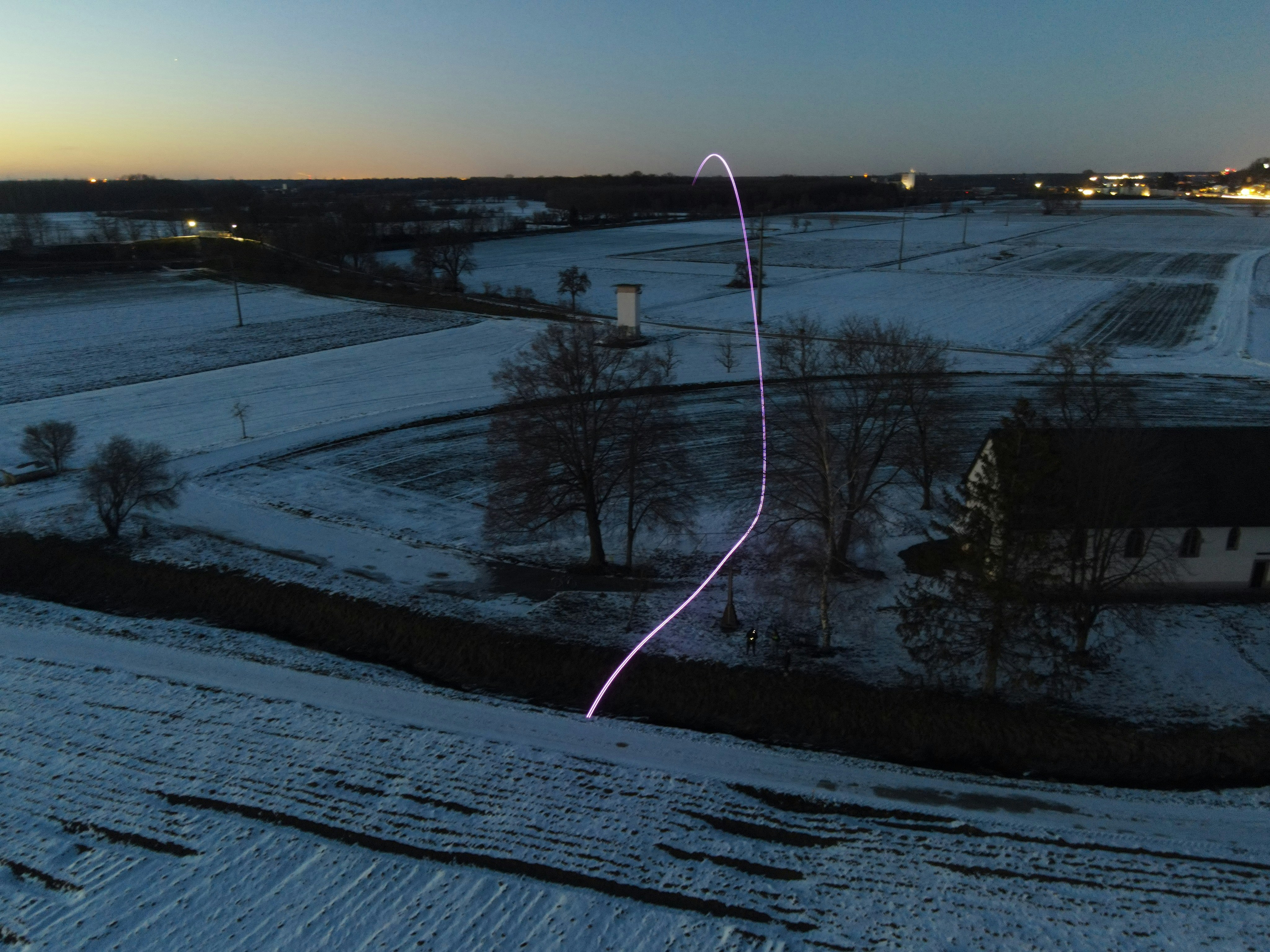Winter's Aerial Dance: Drone Trails at Dusk