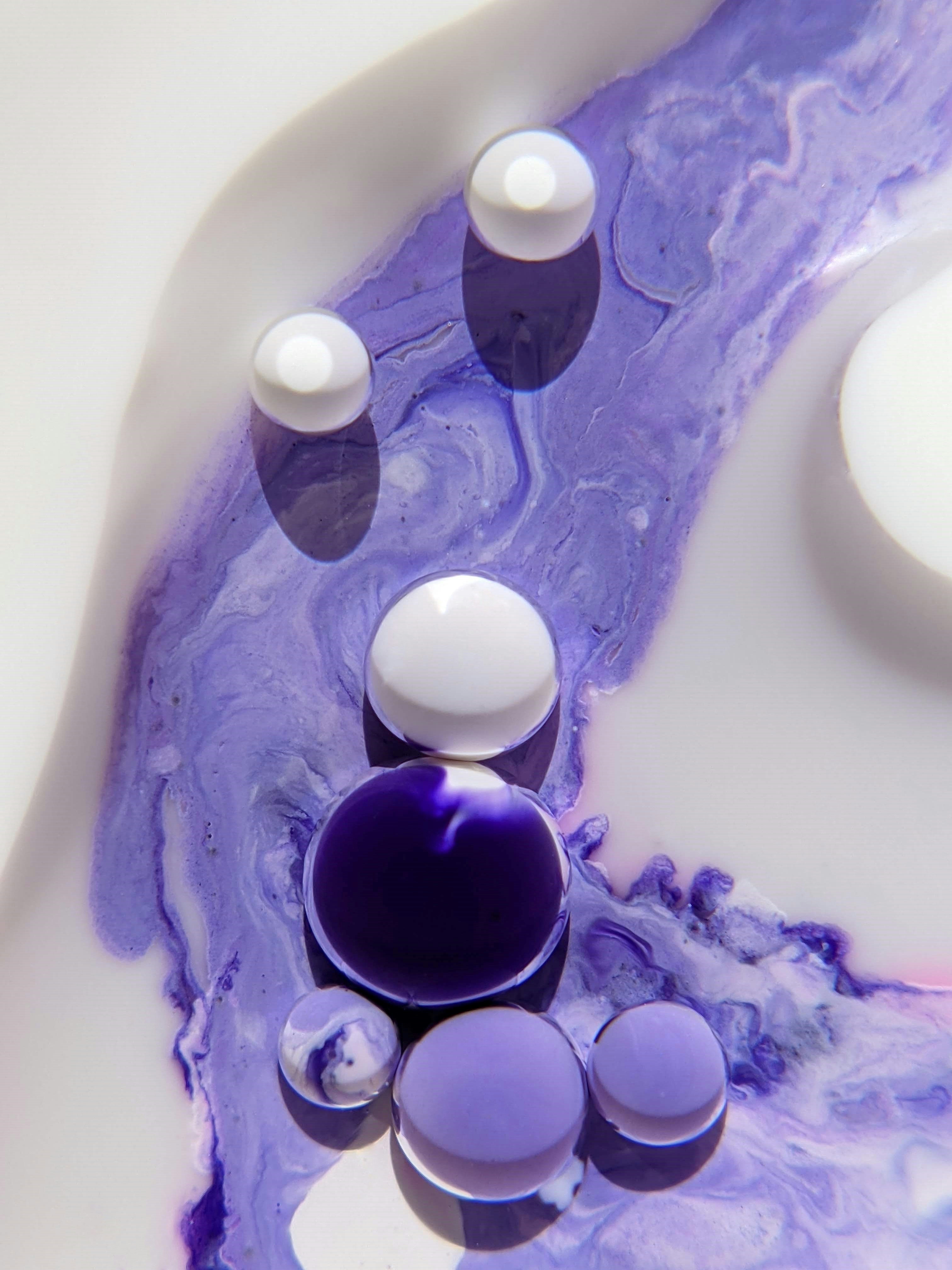 Floating Orbs on a Swirled Violet River