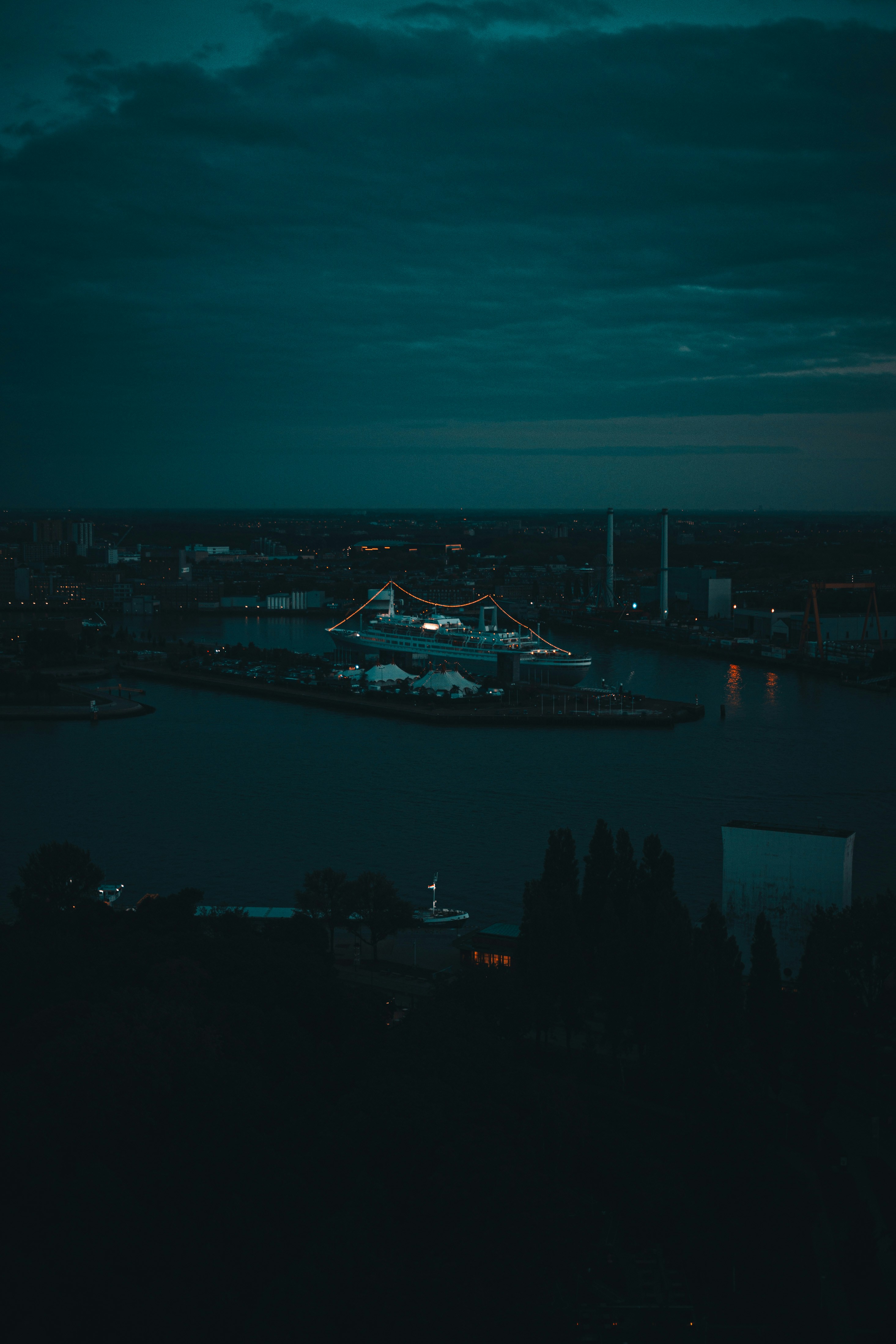Harbor at Dusk: Neon Shipyard Lights Sketch the Quiet Horizon