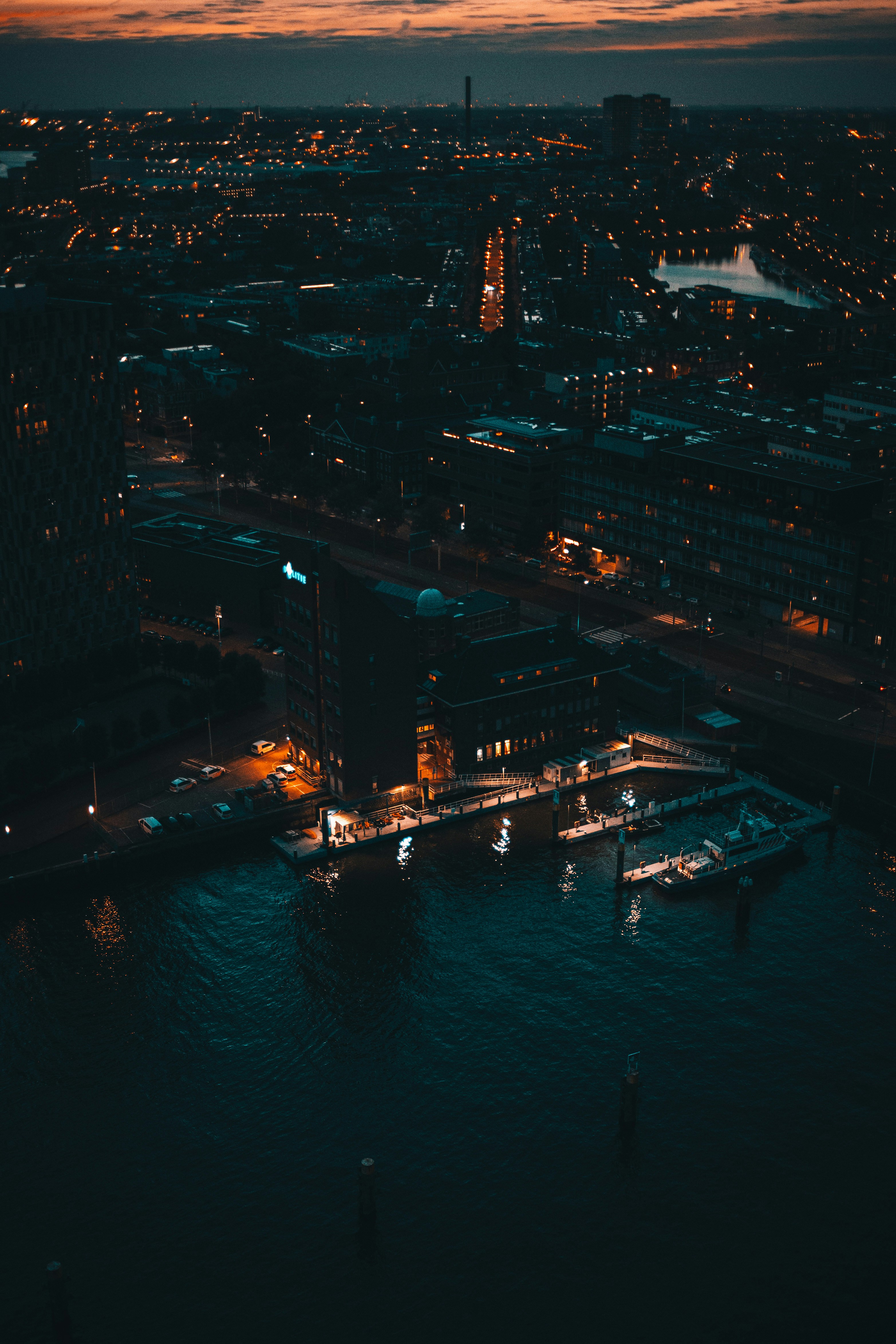 Midnight Marina: A Waterfront District Bathed in Orange Glow