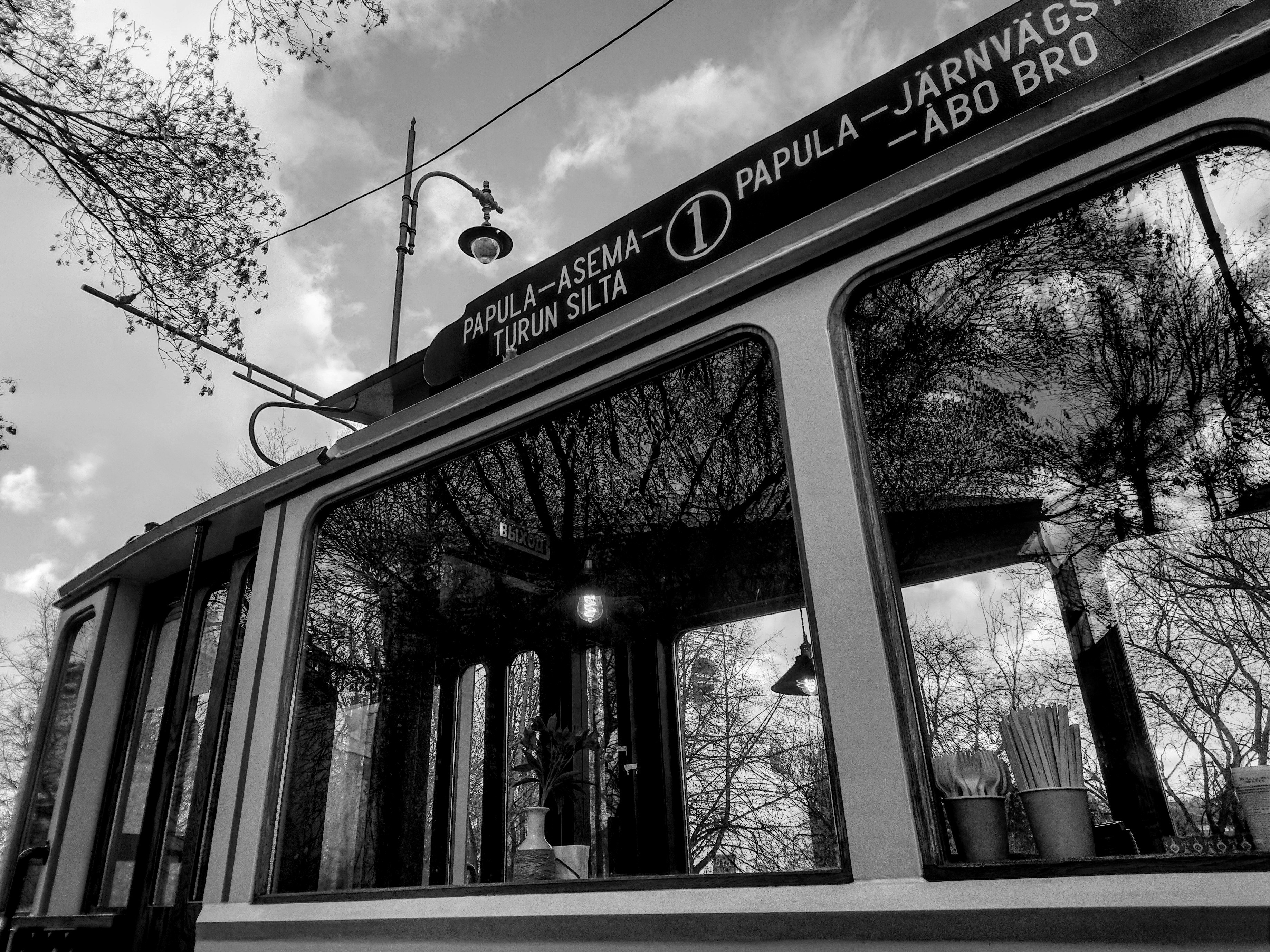 Vintage tram in Vyborg | a black and white photo of a train car