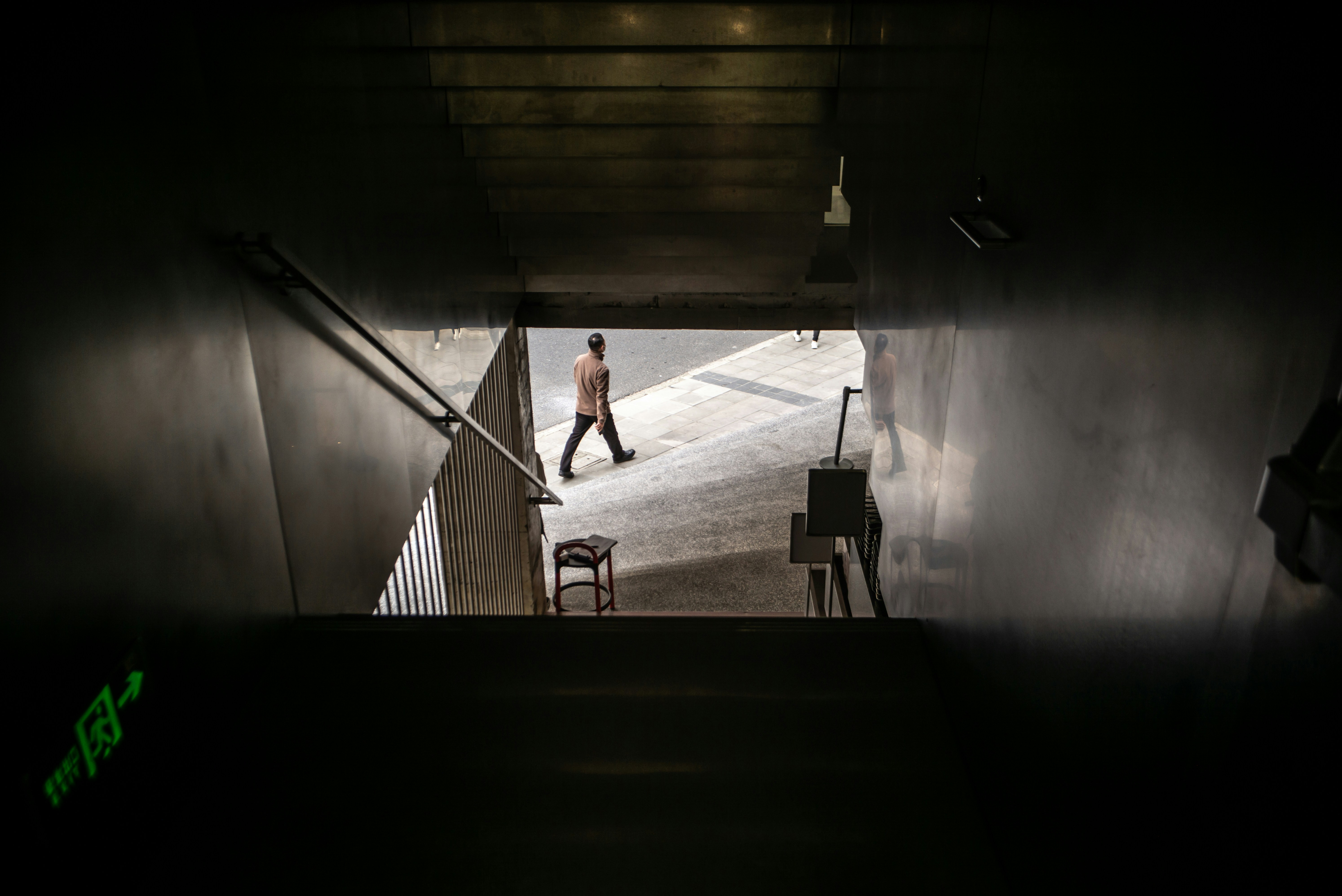 A man walking down a flight of stairs photo – Free Grey Image on Unsplash