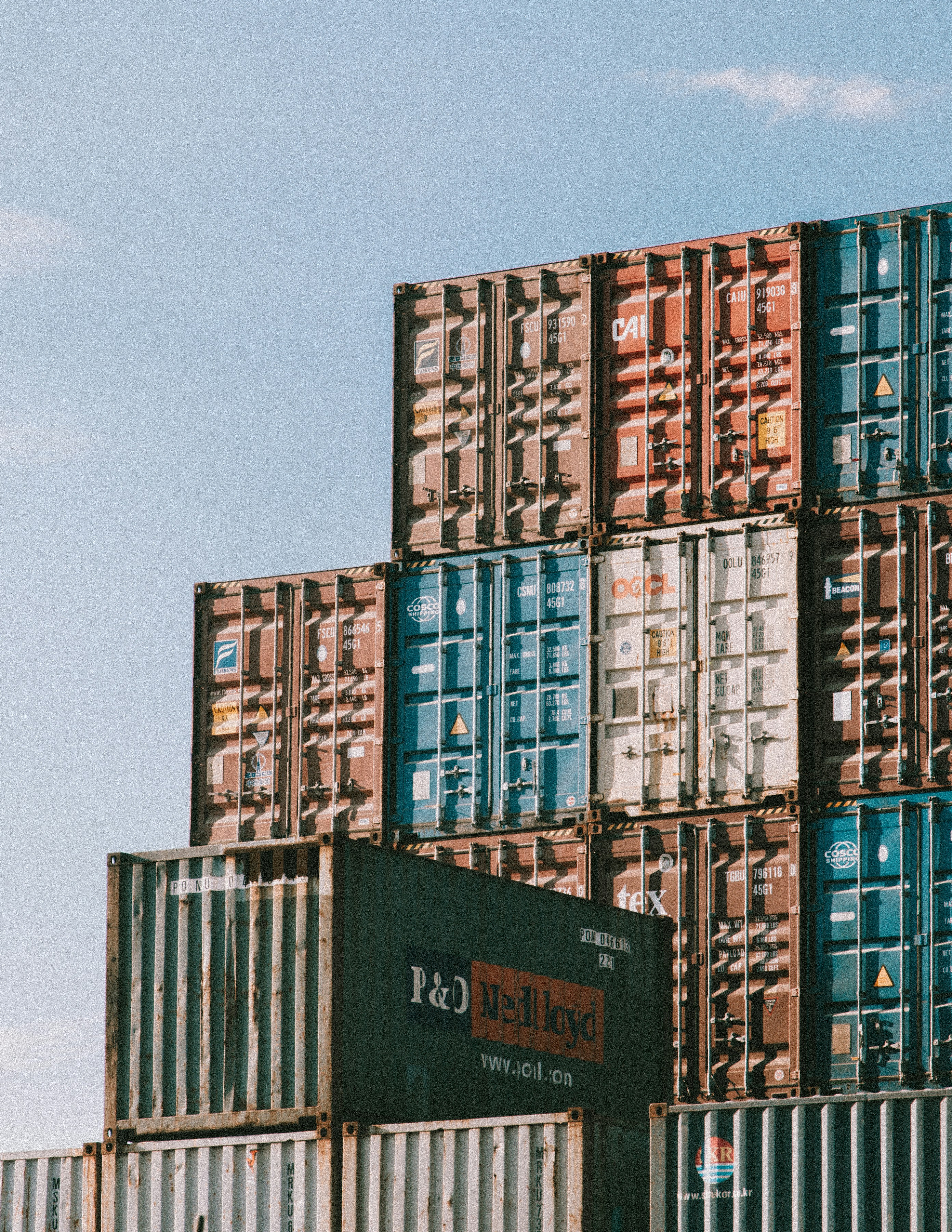 A large stack of shipping containers stacked on top of each other photo ...