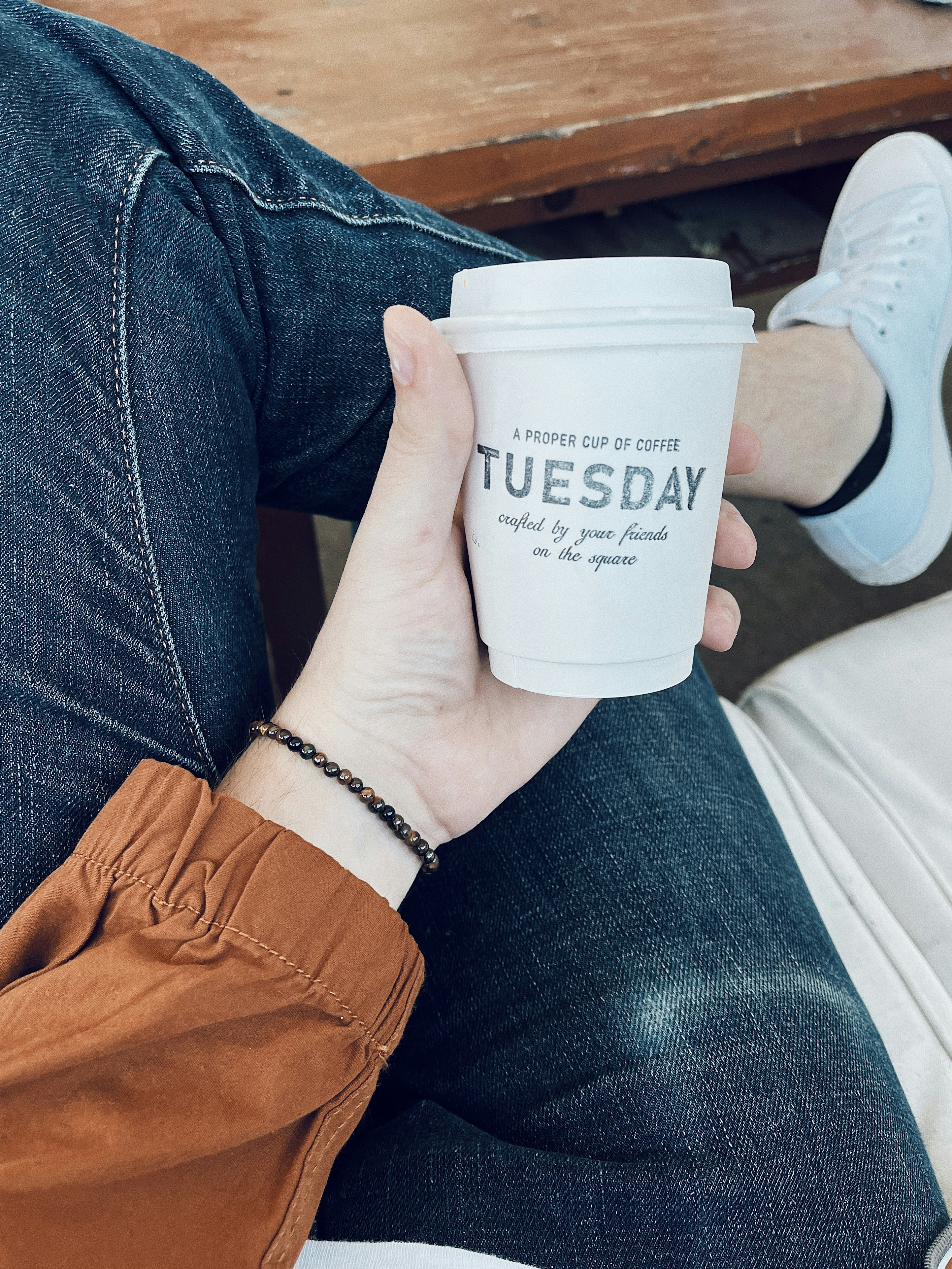 Tuesday in Hand: A Quiet Moment of Coffee, Denim, and Sneakers