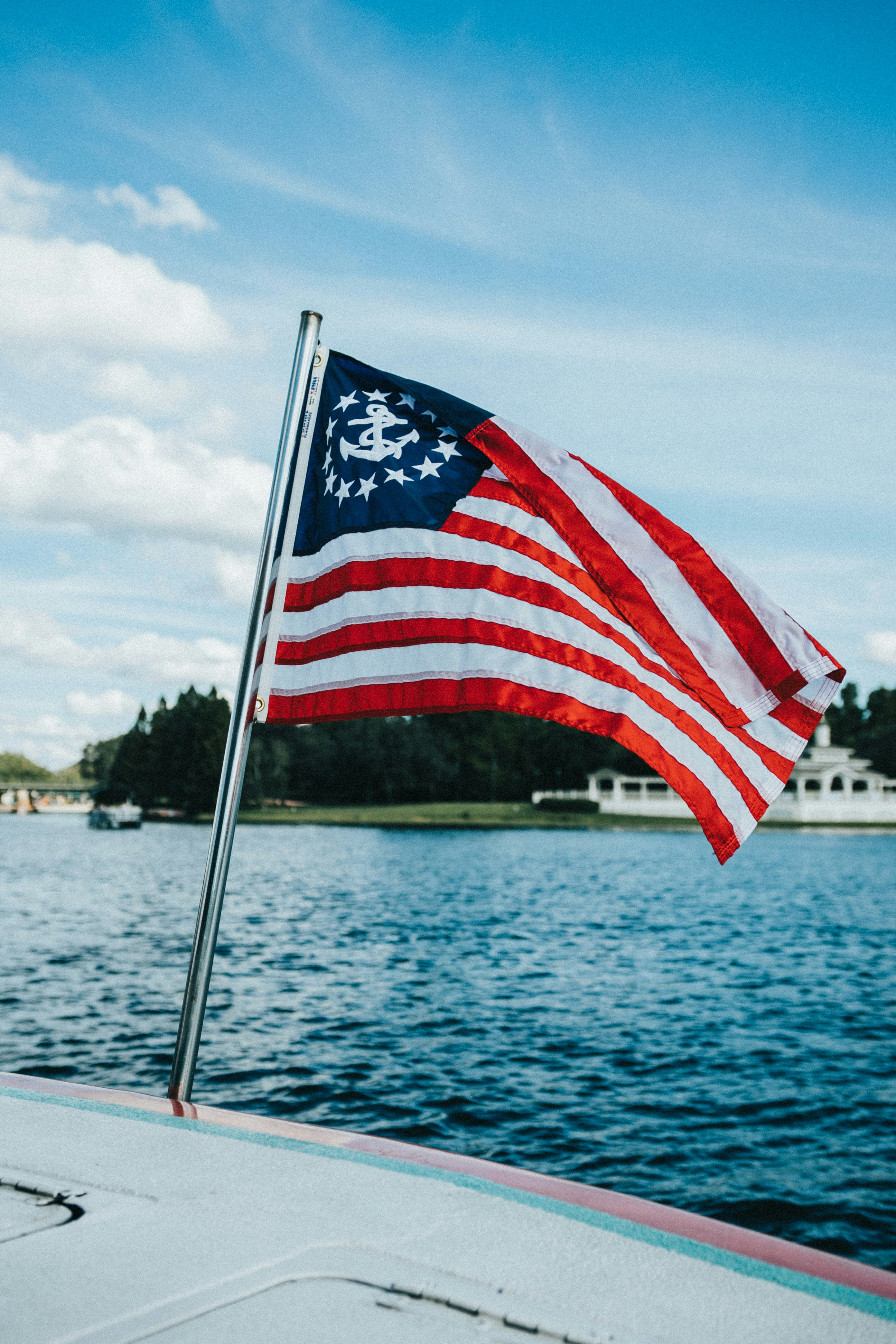 An american flag on a boat in the water photo – Free Florida Image on ...