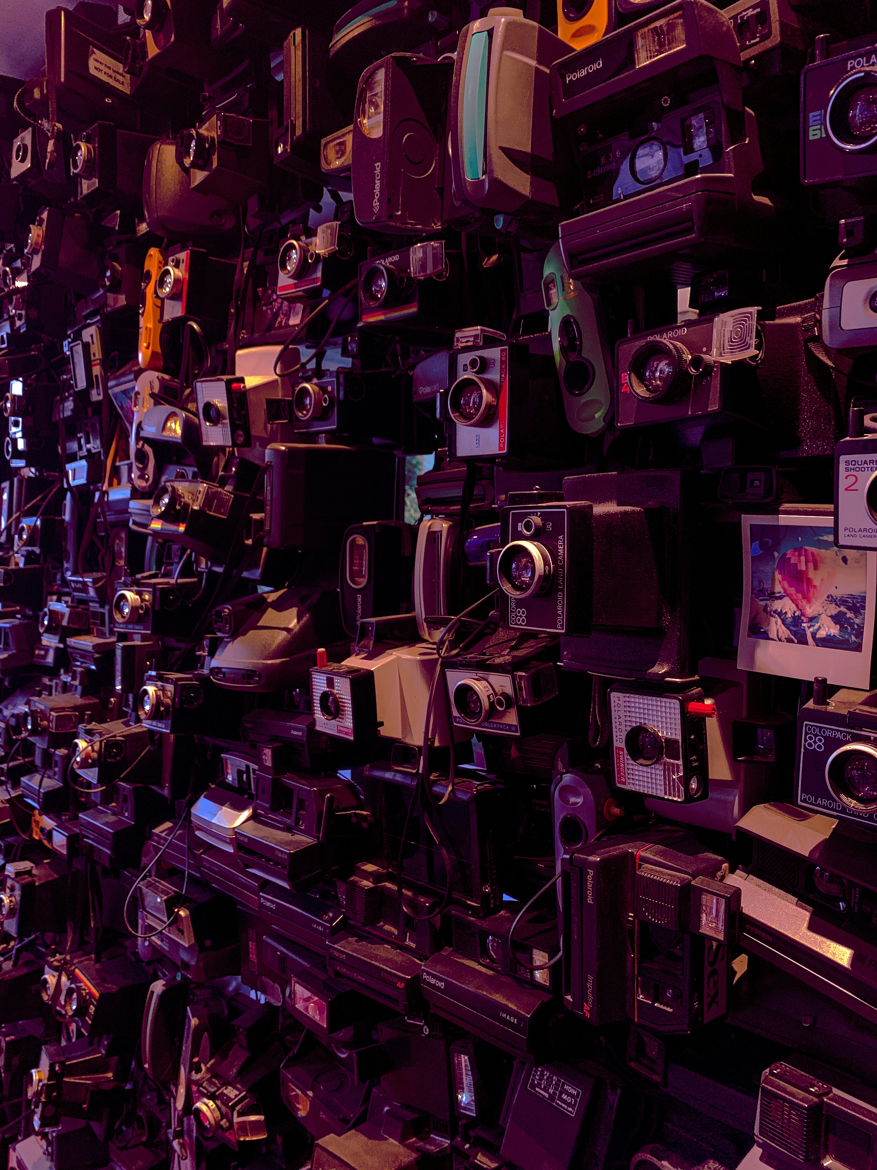 A room filled with lots of different types of electronics photo – Free ...
