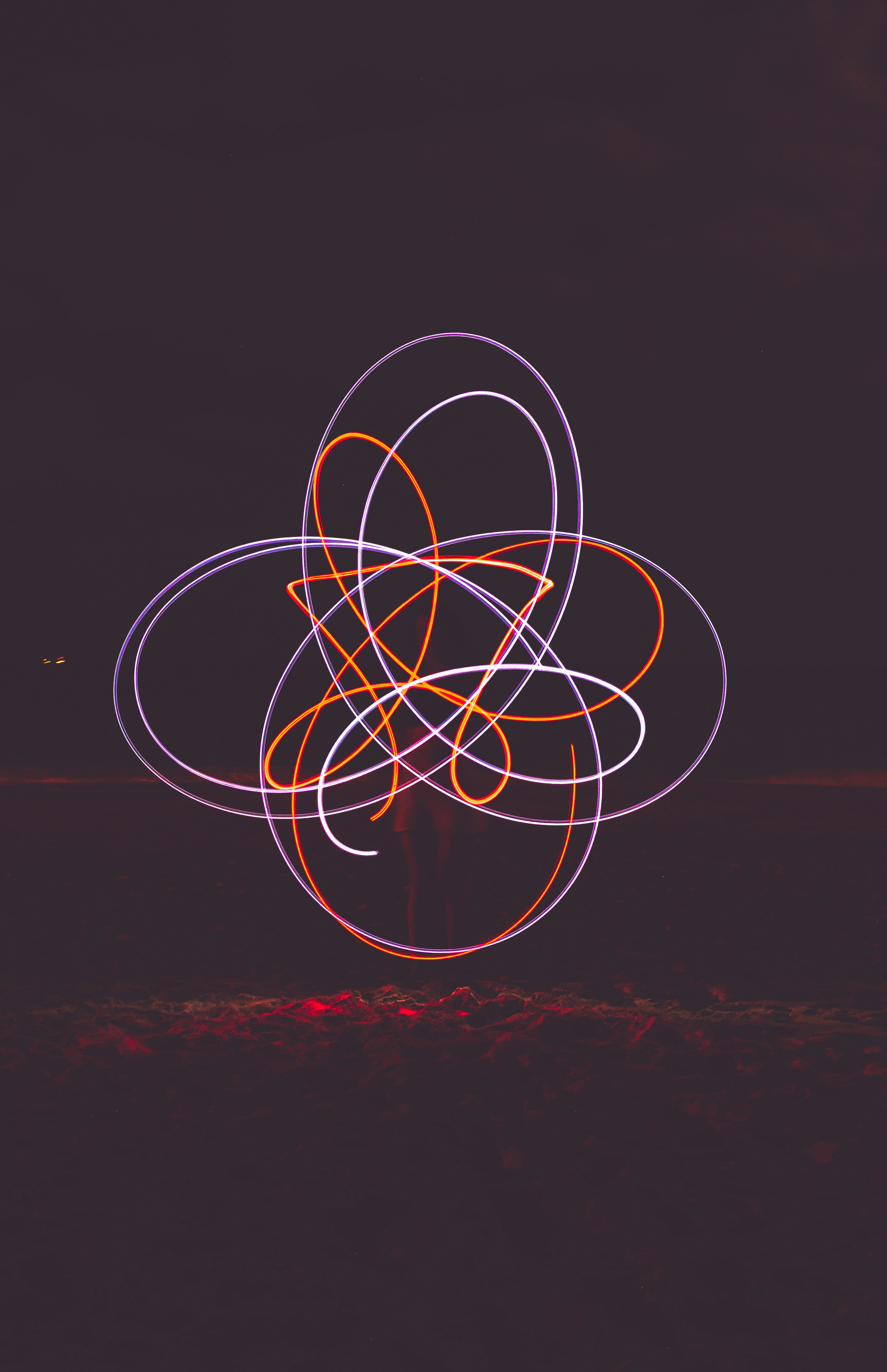 Neon Dervish on the Night Shore: A Tangle of Glowing Loops