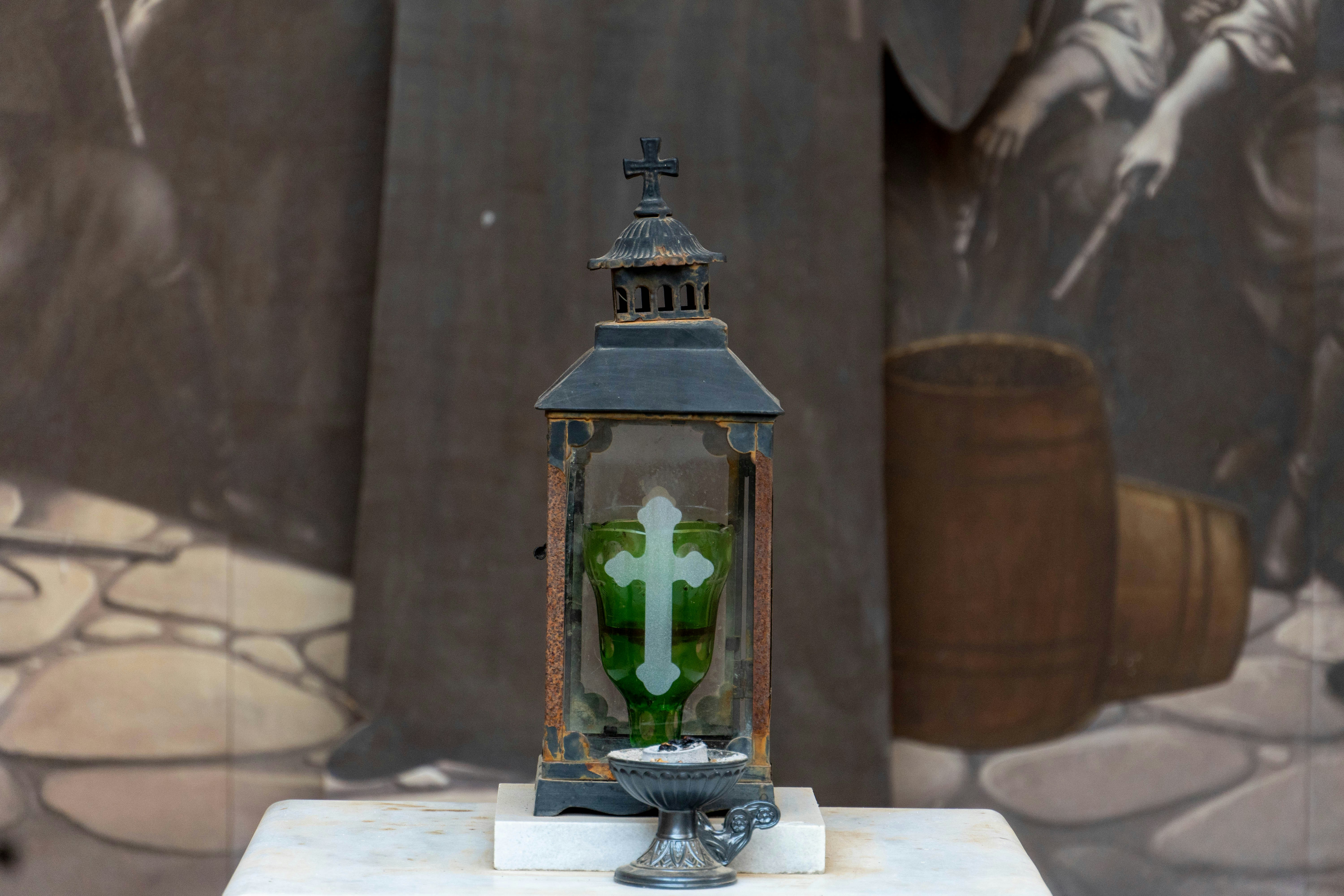 Rustic Lantern on Marble Stage: A Quiet Vigil