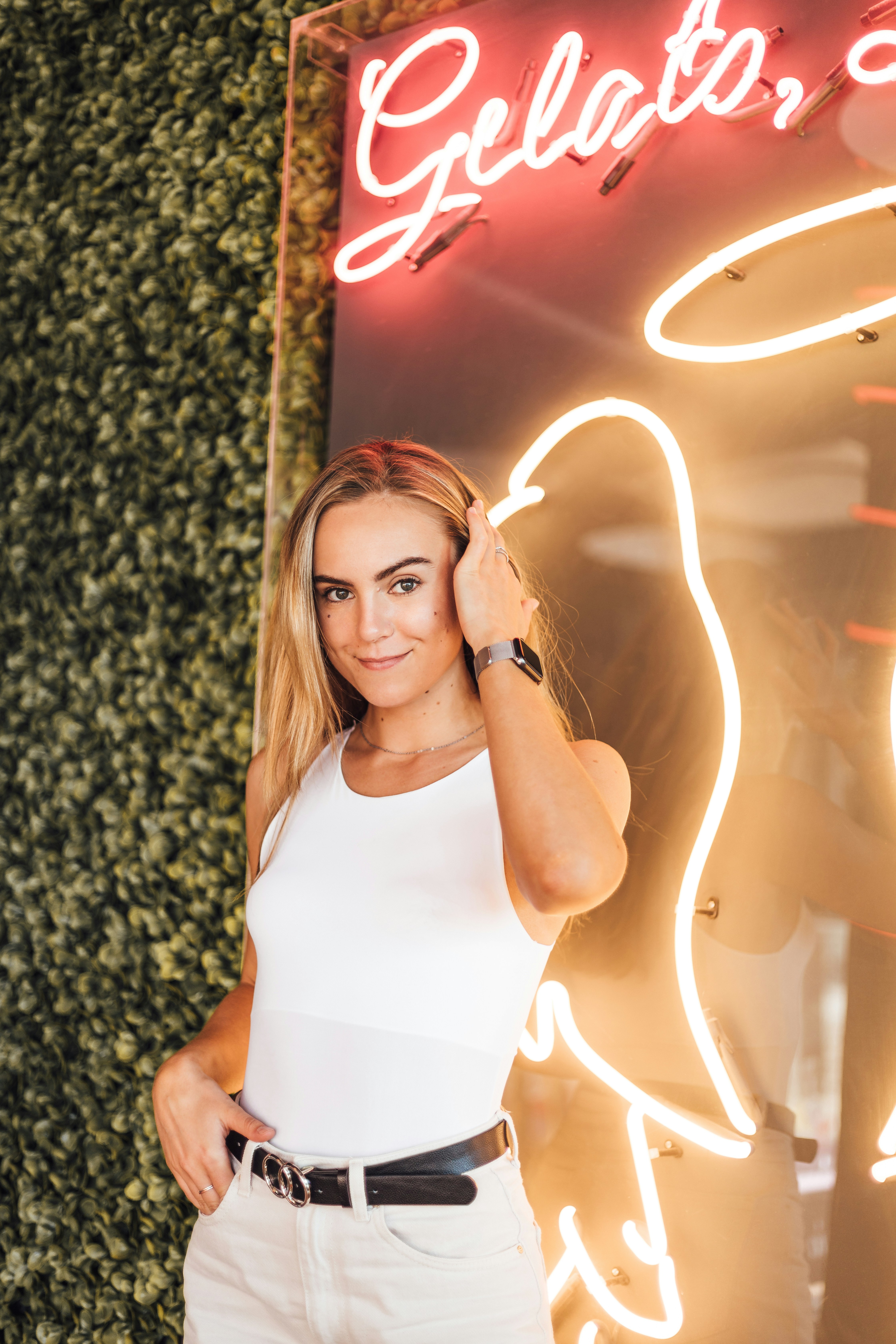Neon Gelato Portrait: Warm Light, Leafy Backdrop, Quiet Confidence