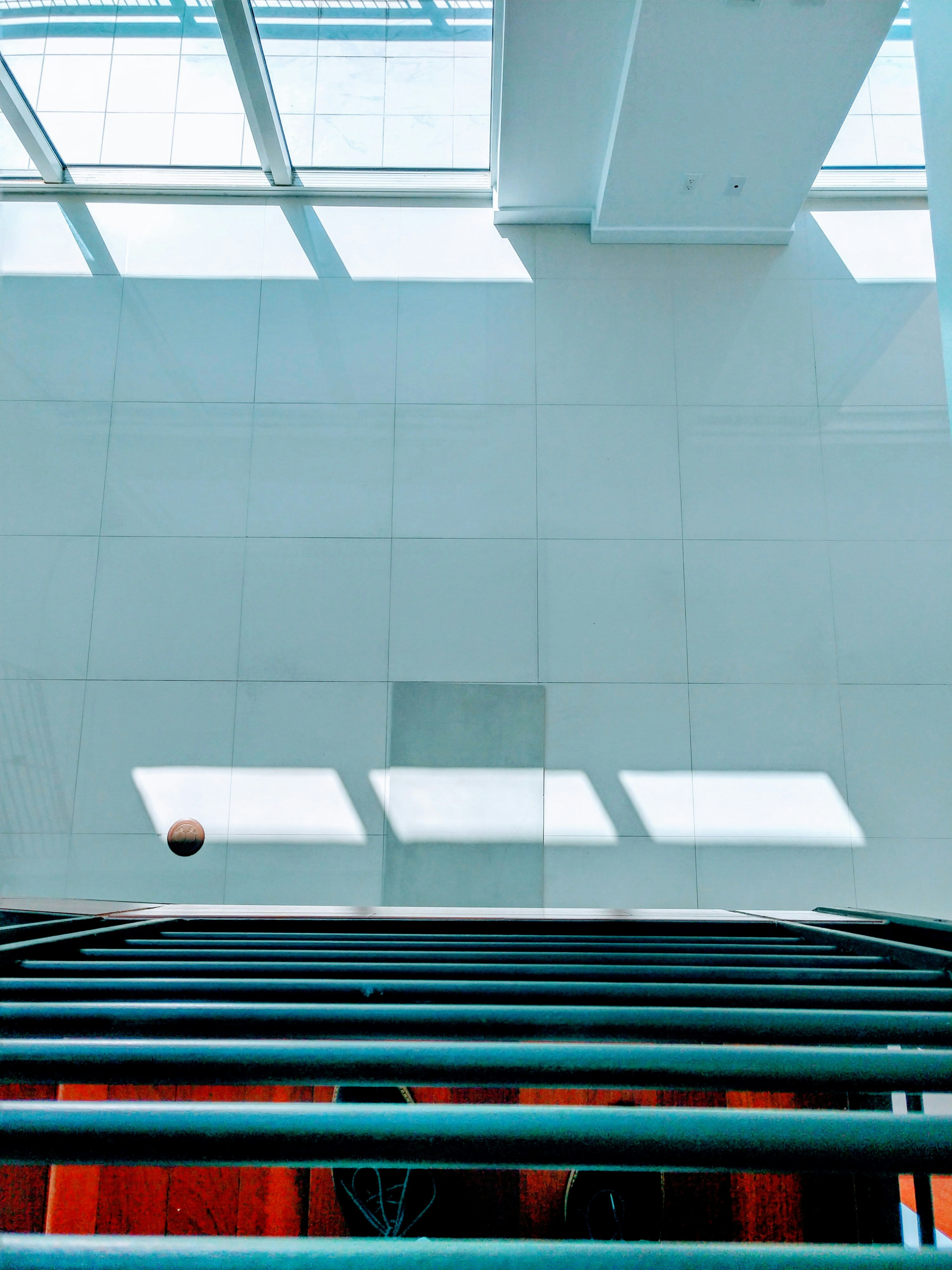 The ceiling of a building with a ball in the middle of it photo – Free ...