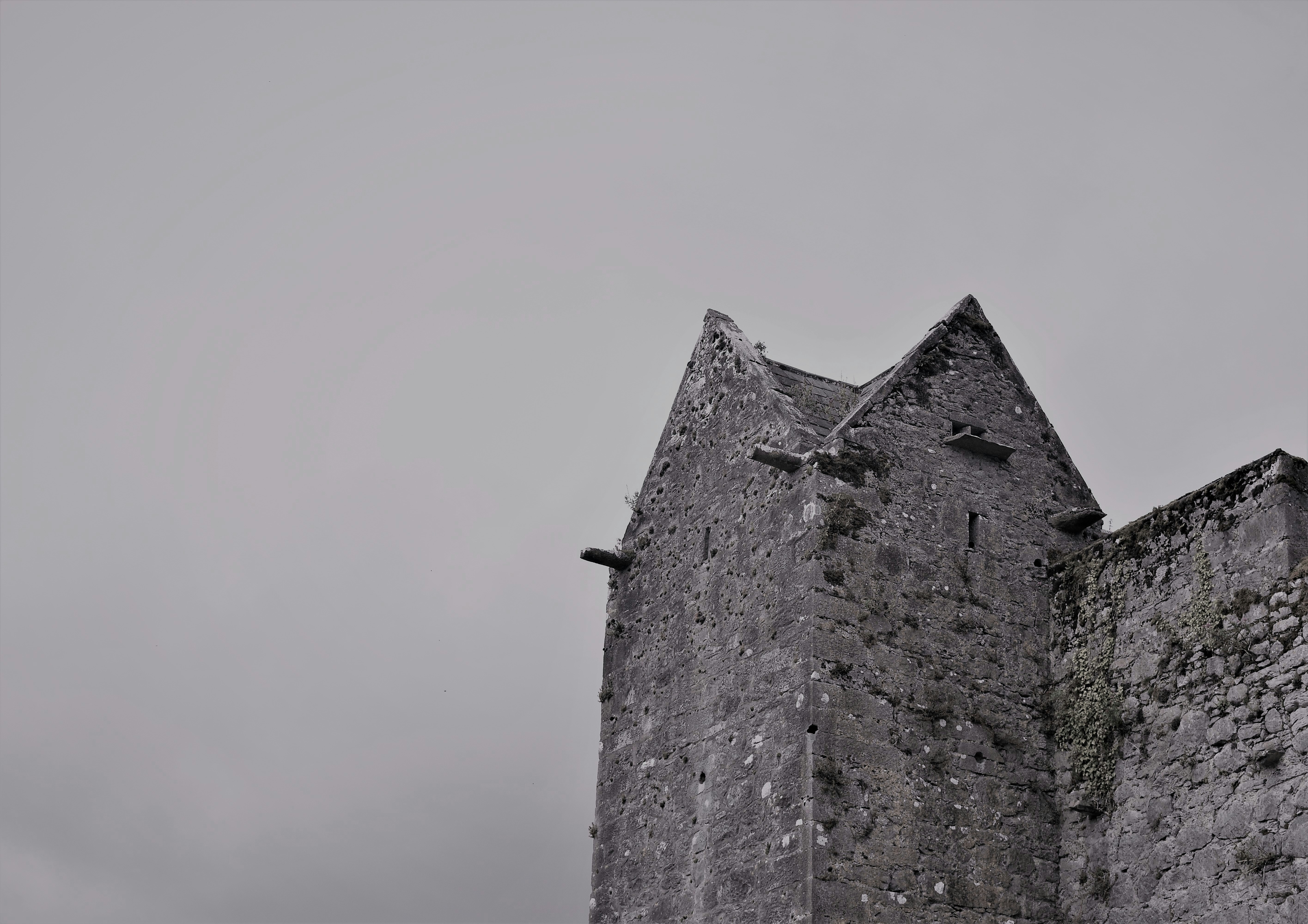 an old castle with a clock on the side of it