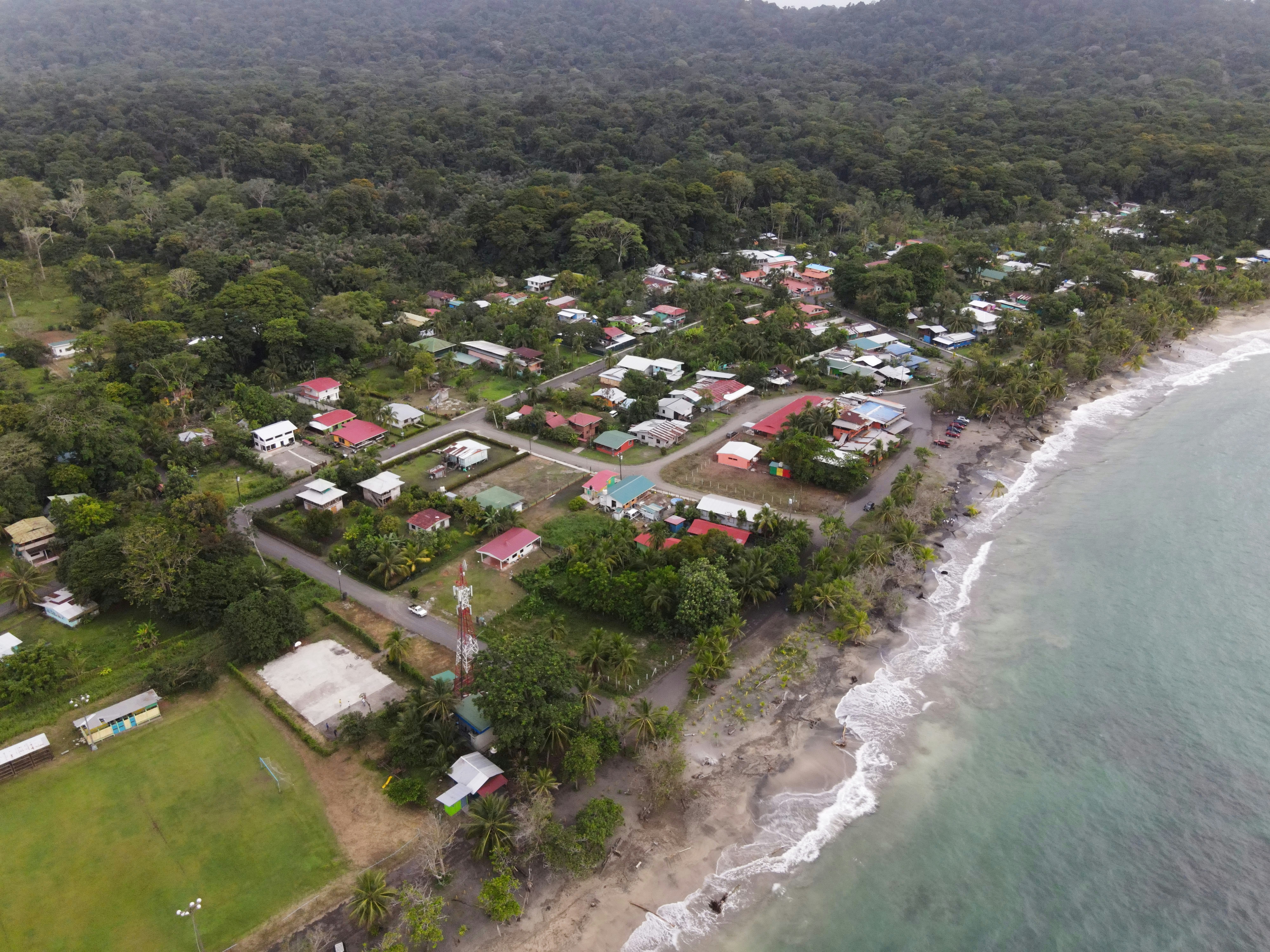 An aerial view of a small town next to the ocean photo – Free ...