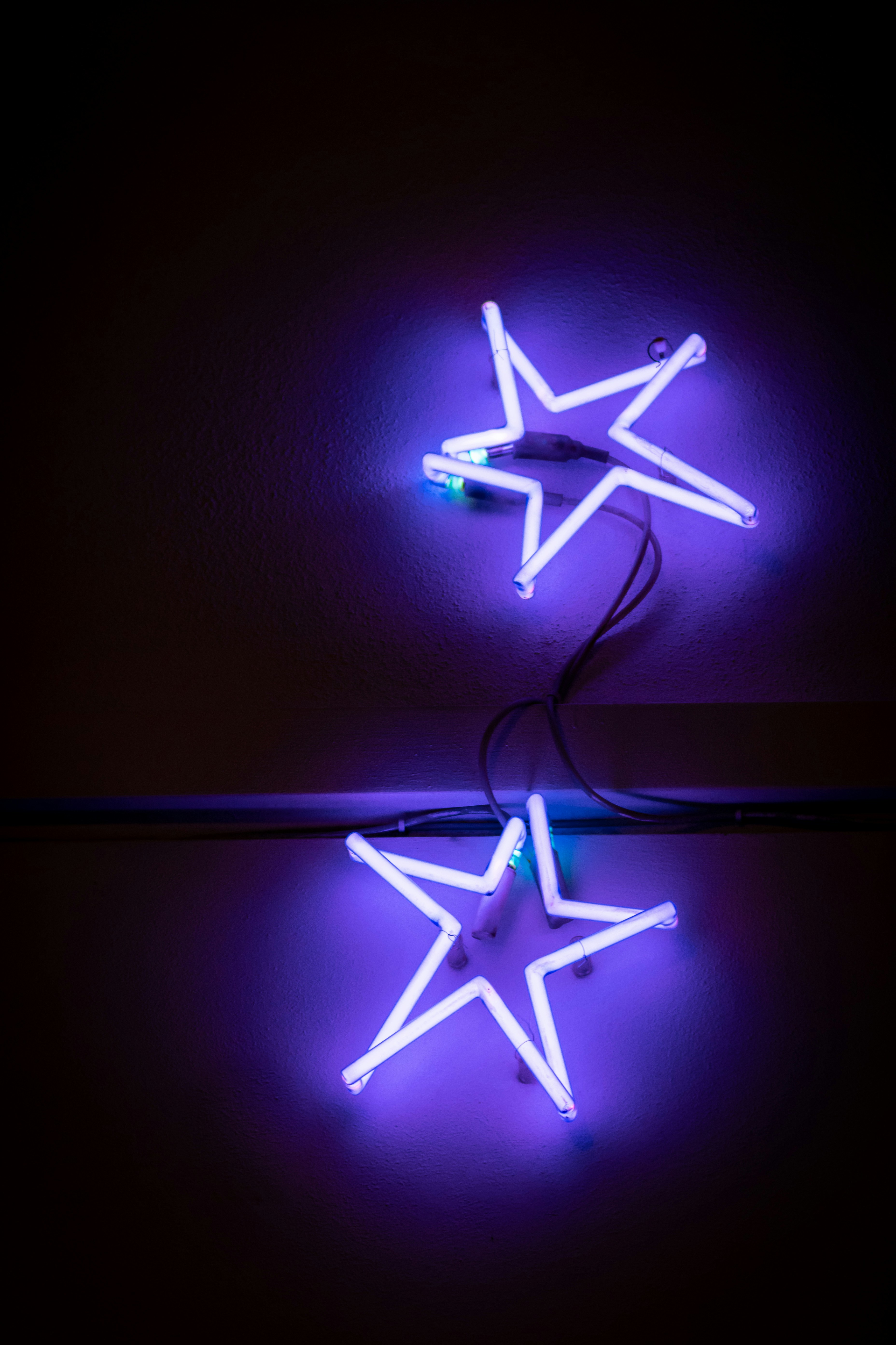 Two Neon Starlets in a Quiet Blue Glow