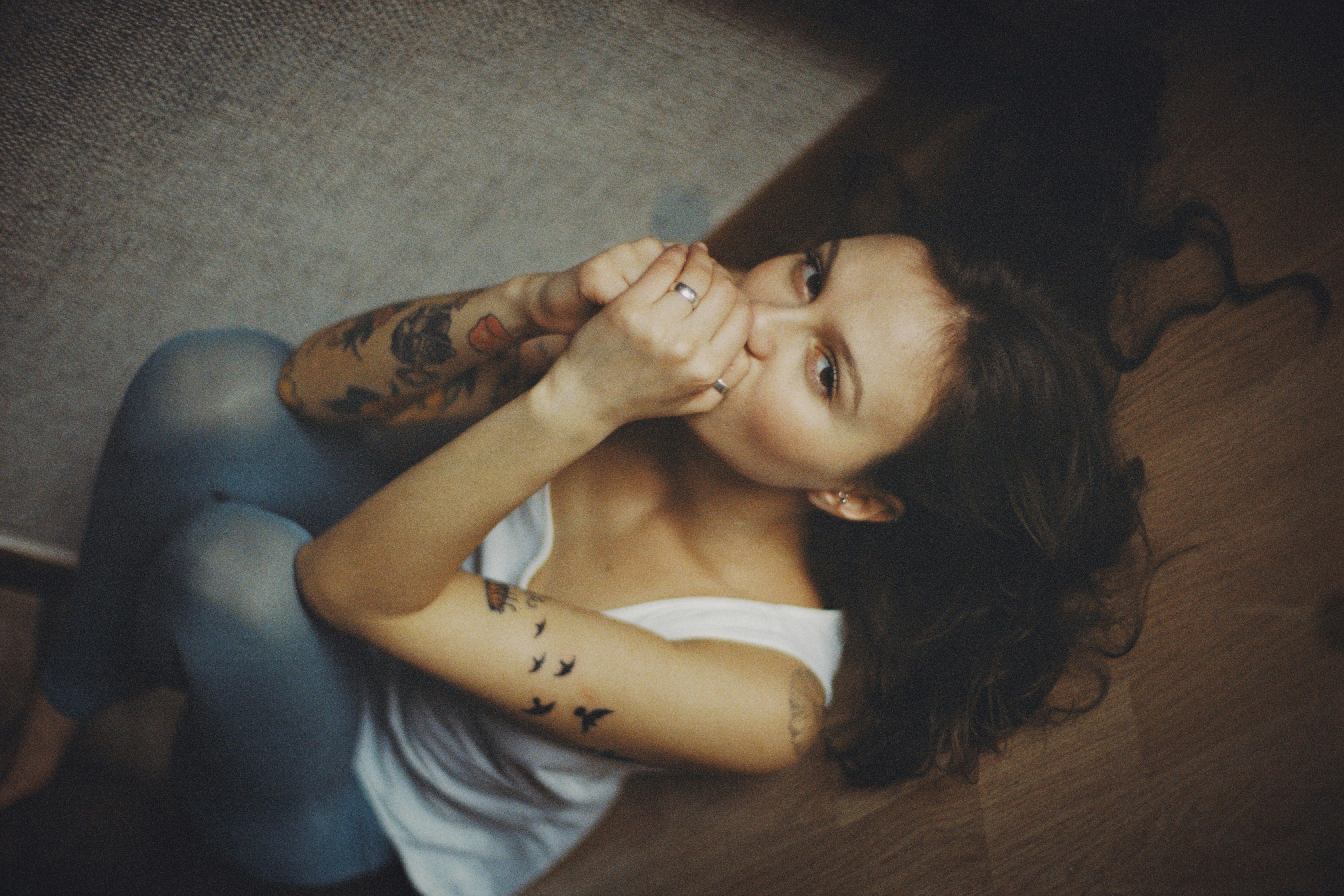 Overhead Reverie: Tattooed Portrait on a Wooden Canvas