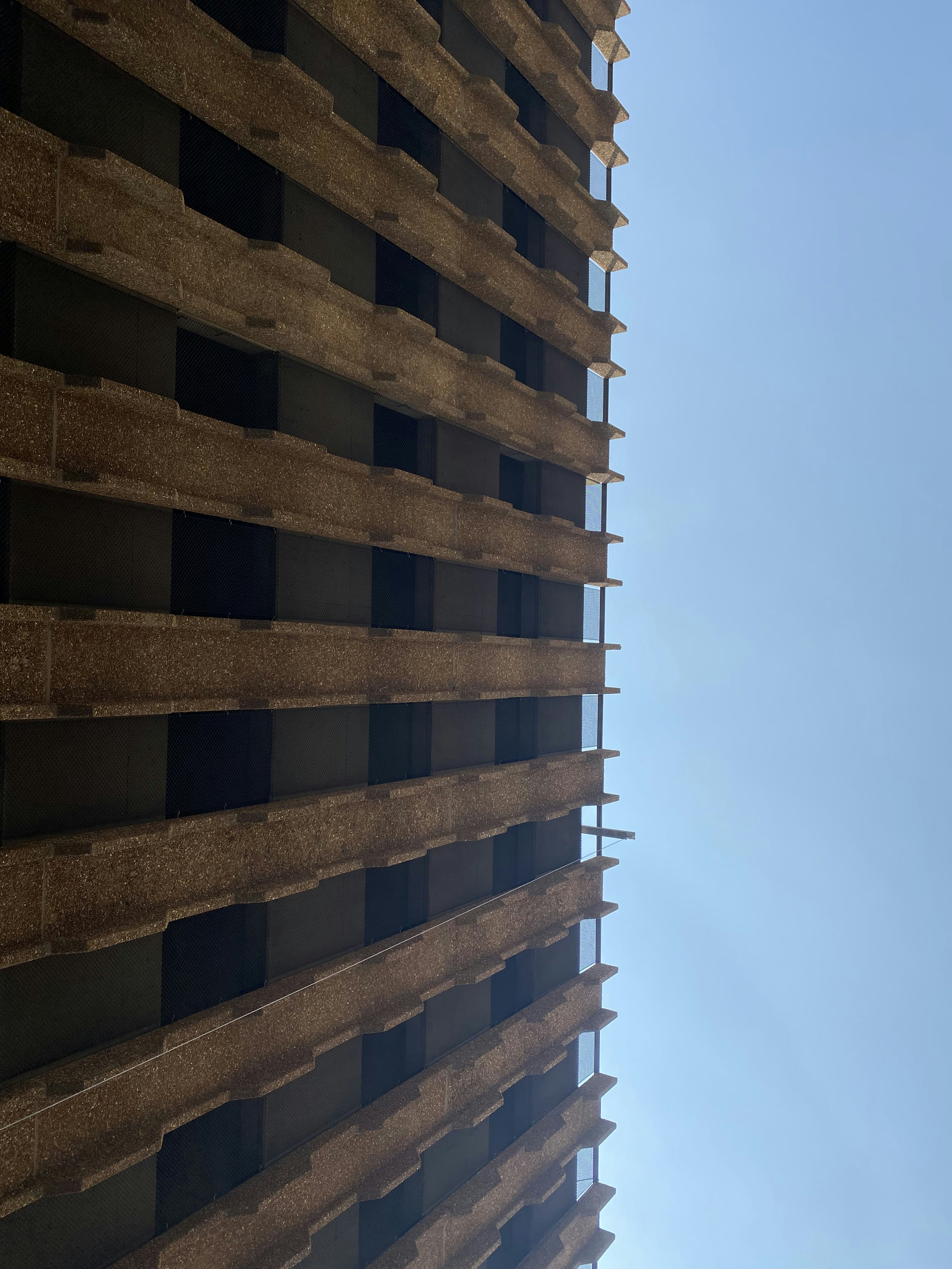 a close up of a building with a blue sky in the background