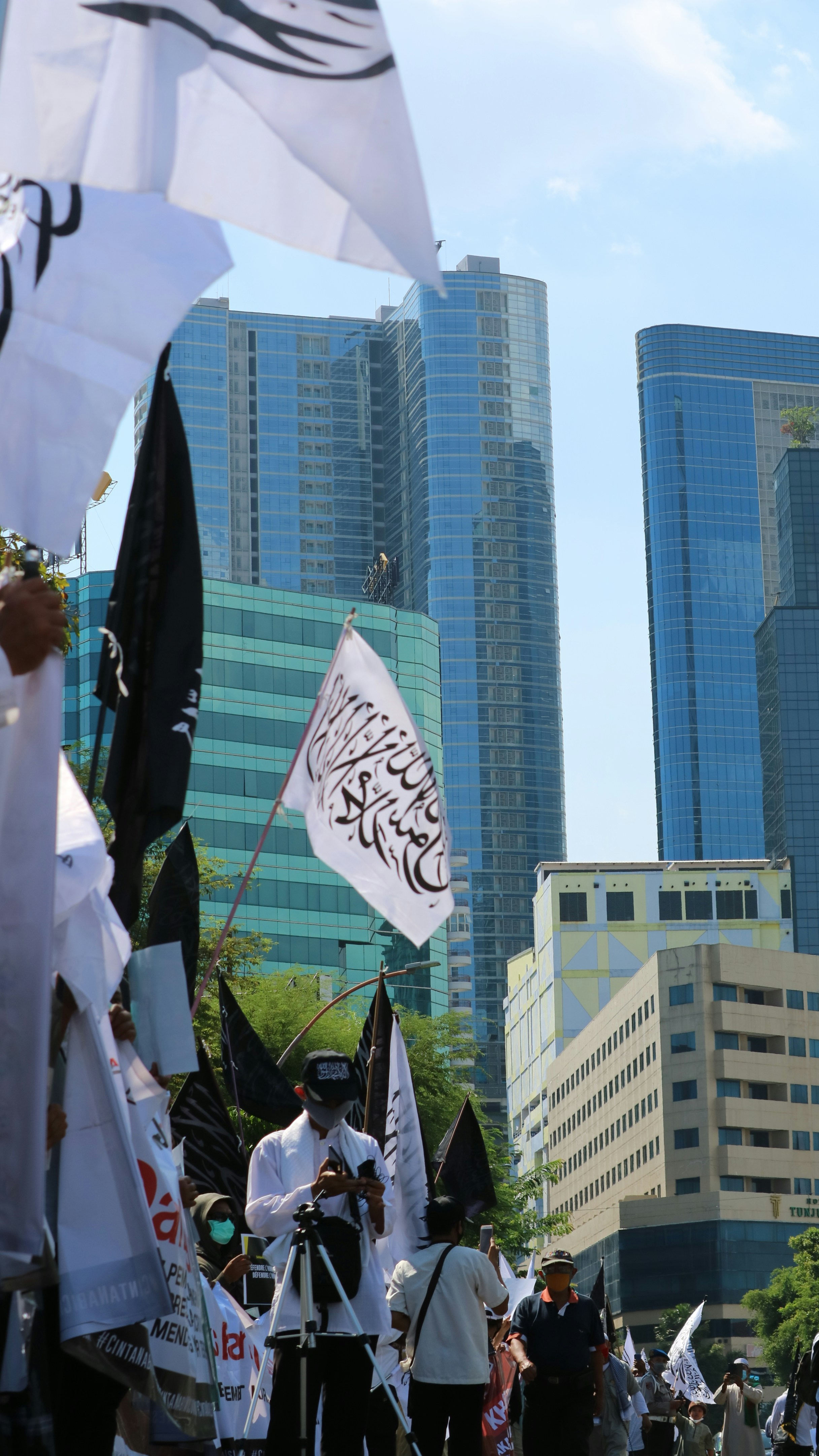 A group of people marching in a parade photo – Free Surabaya Image on ...