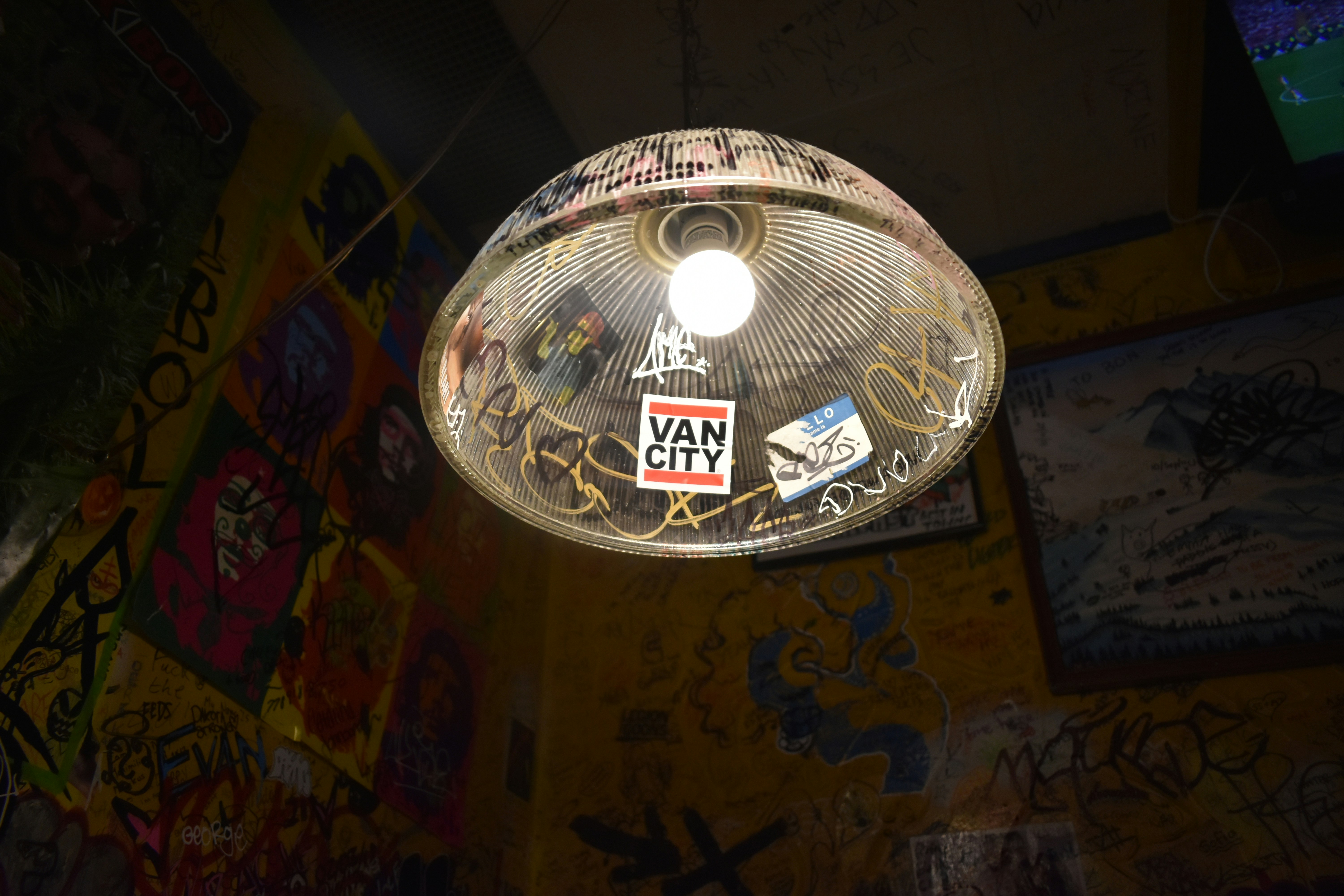 Globe of Light Over Graffiti: A Quiet Neon Moment