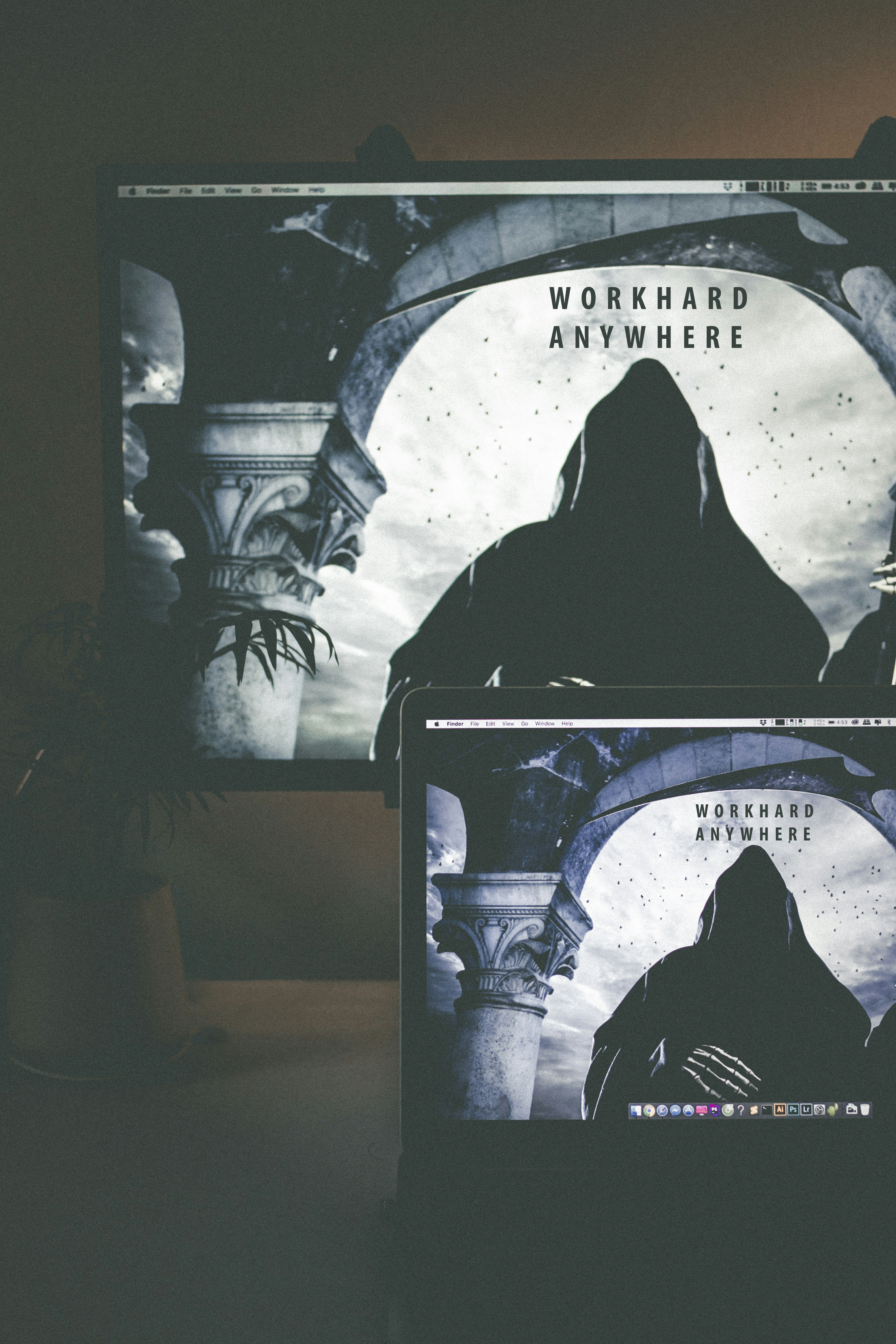 Hooded Silhouette Across Dual Screens — Workhard Anywhere