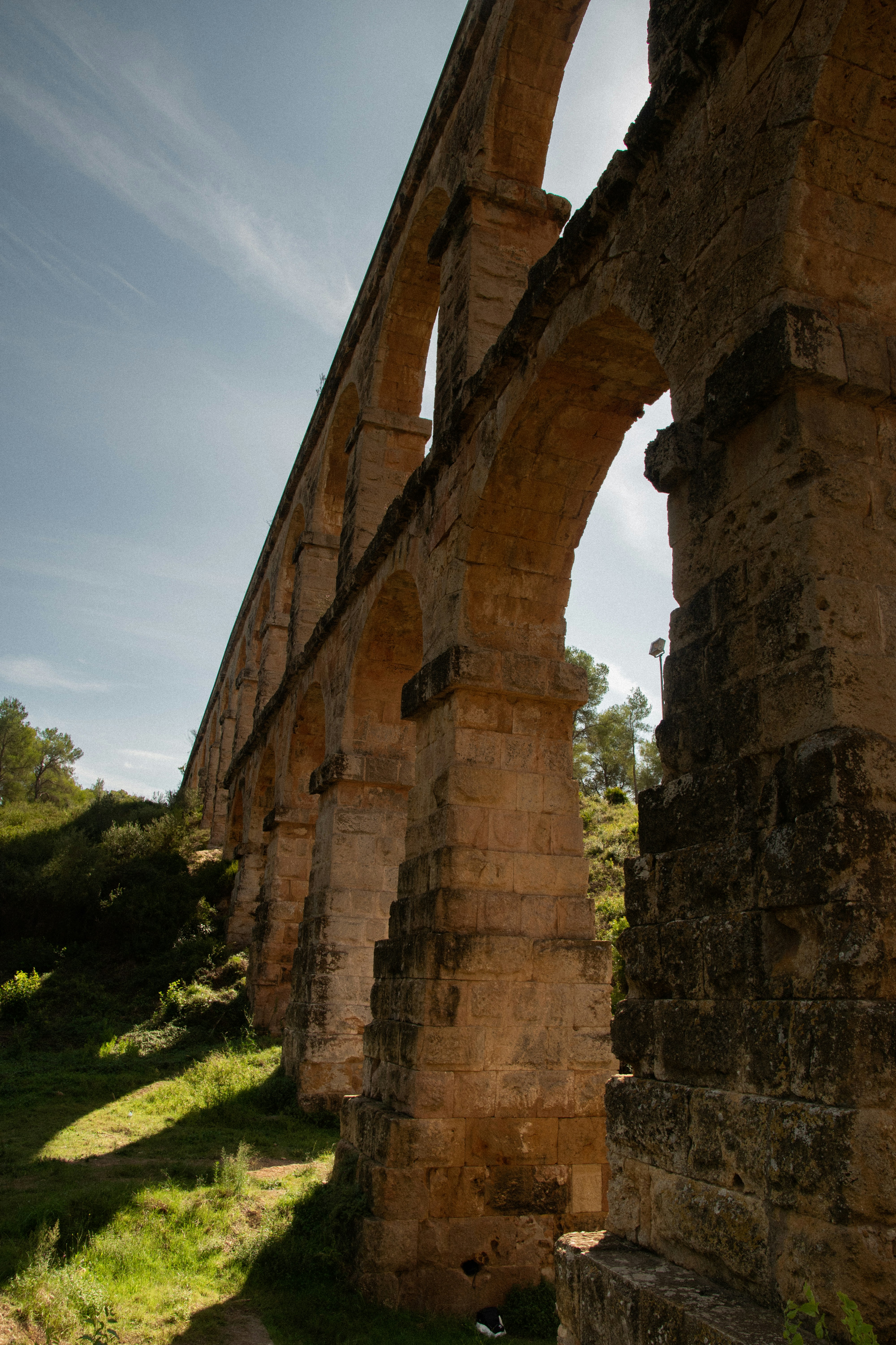 Sunlit Arches: Timeworn Rhythm of a Stone Aqueduct