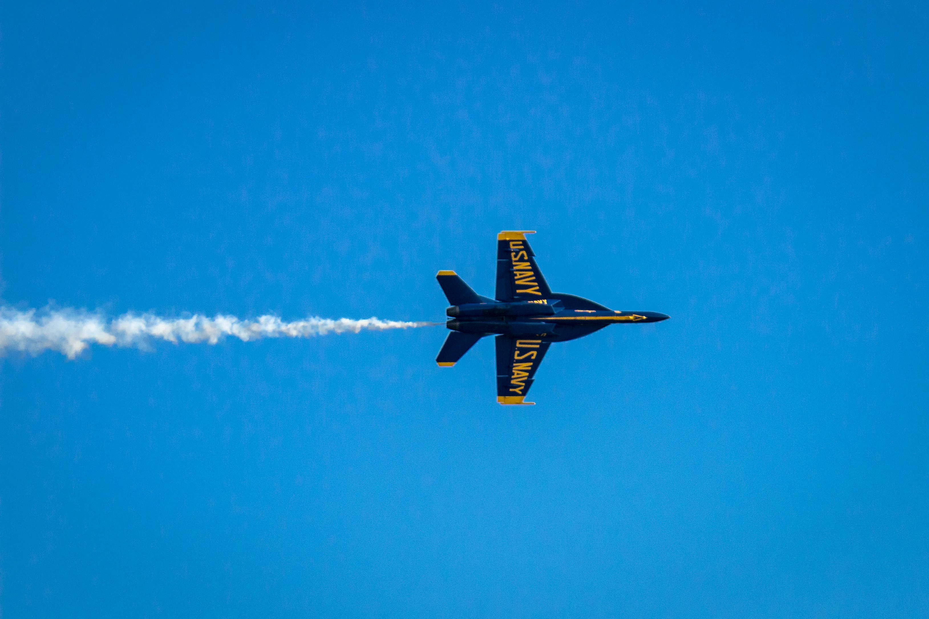 A fighter jet flying through a blue sky photo – Free Blue angels Image ...