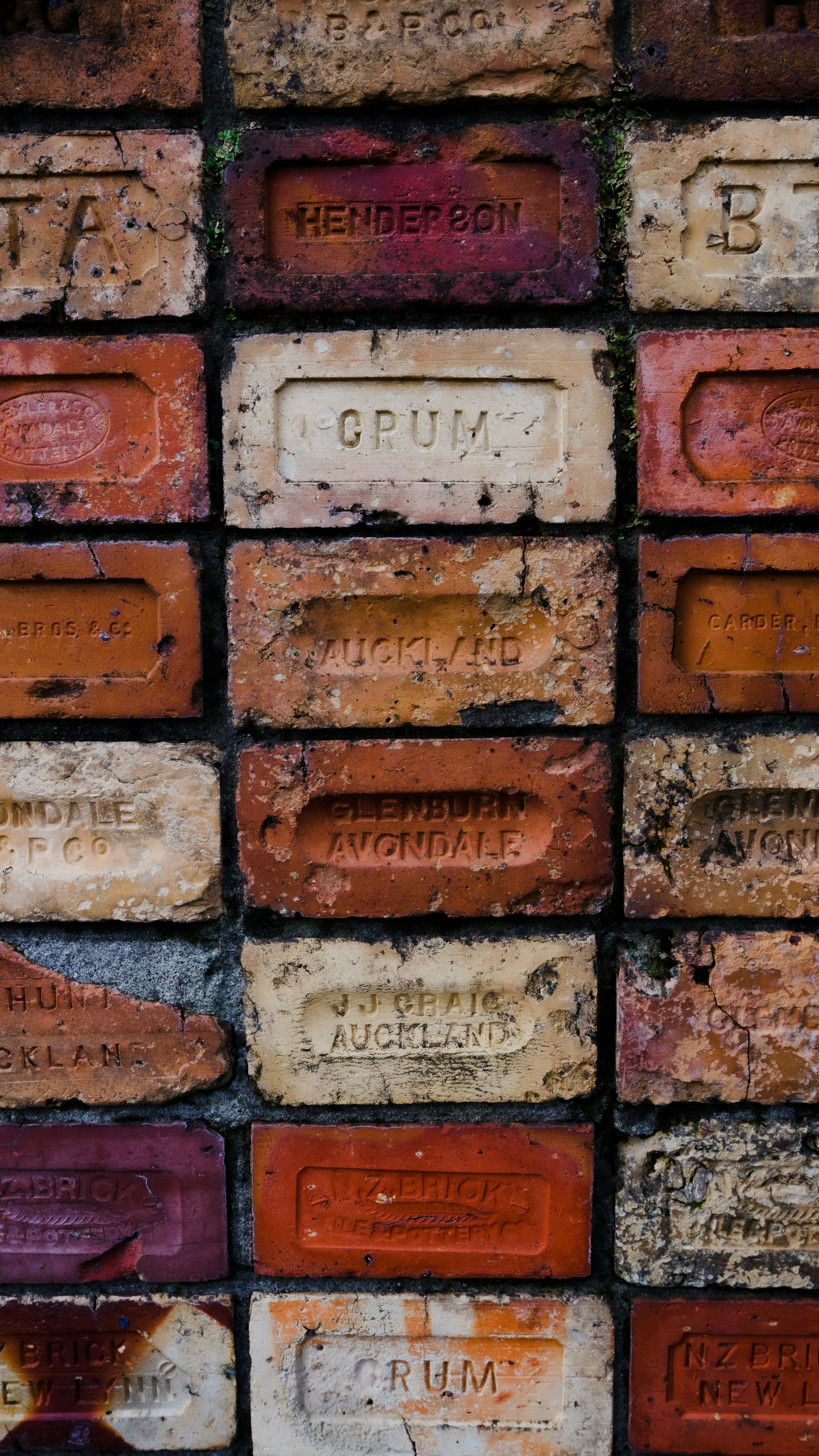 A brick wall that has some writing on it photo – Free Brick Image on ...
