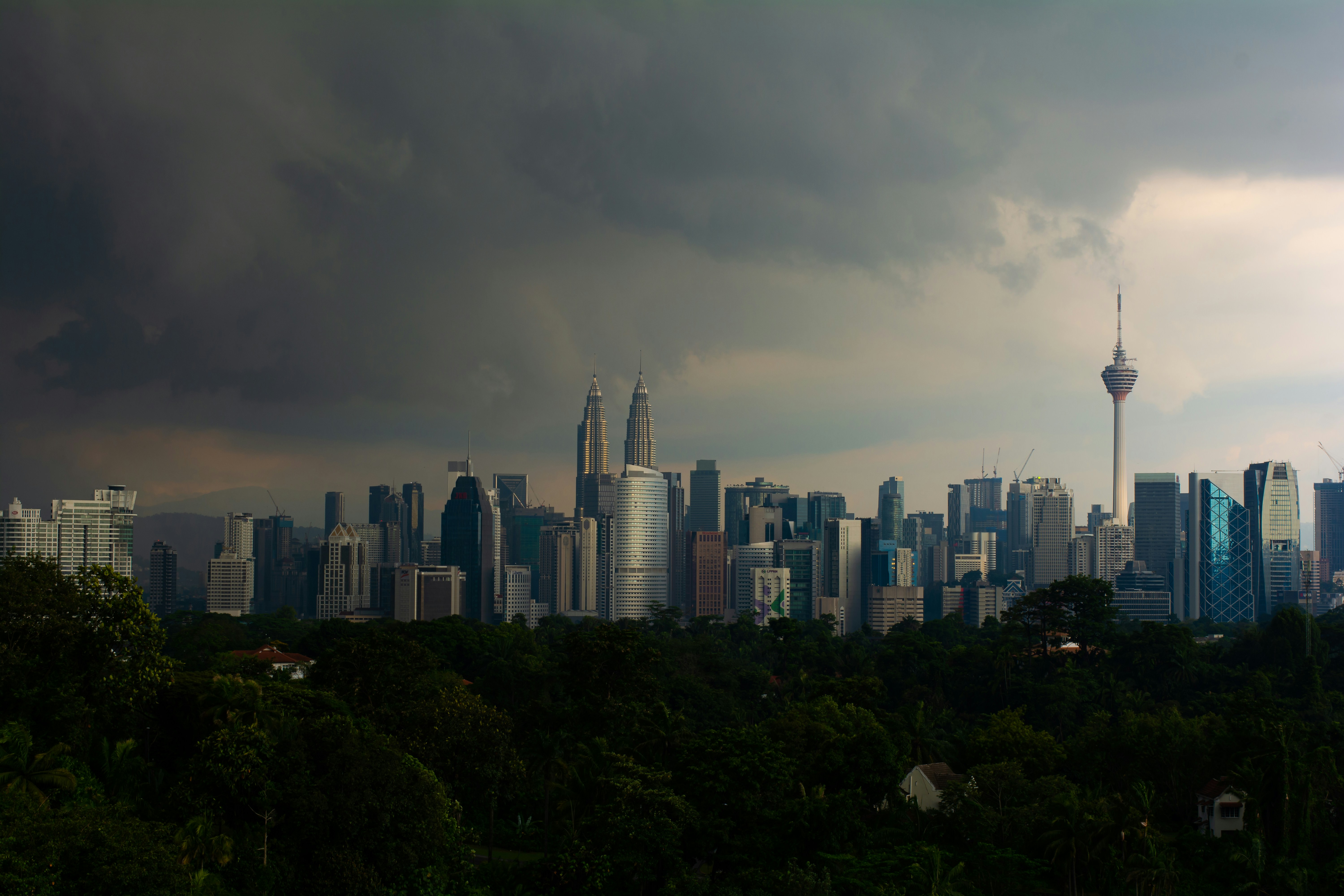 A view of a city from a distance photo – Free Cloudy sky Image on Unsplash