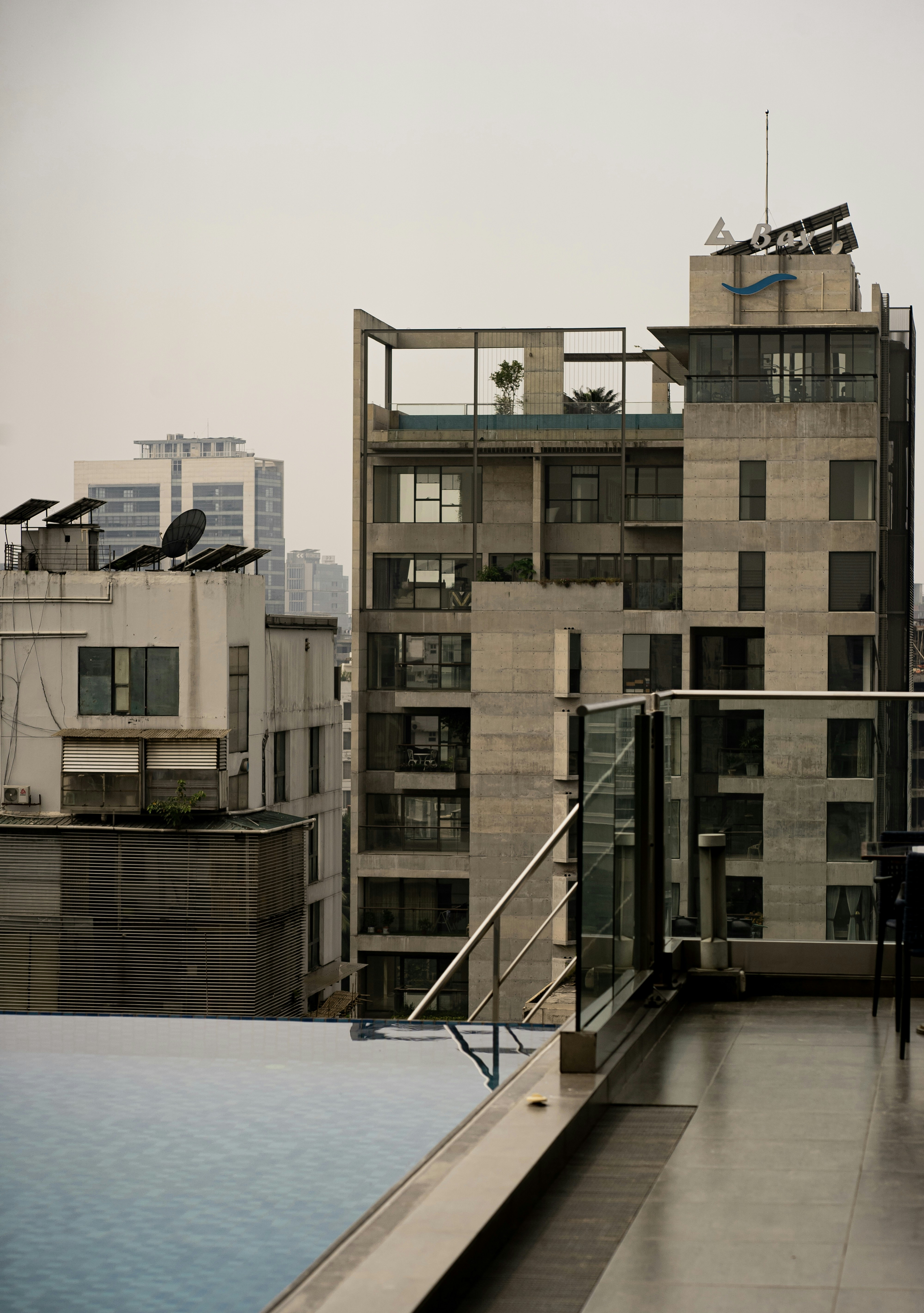 Rooftop Edge: Urban Terrace Overlooking a Grid of Concrete Cliffs