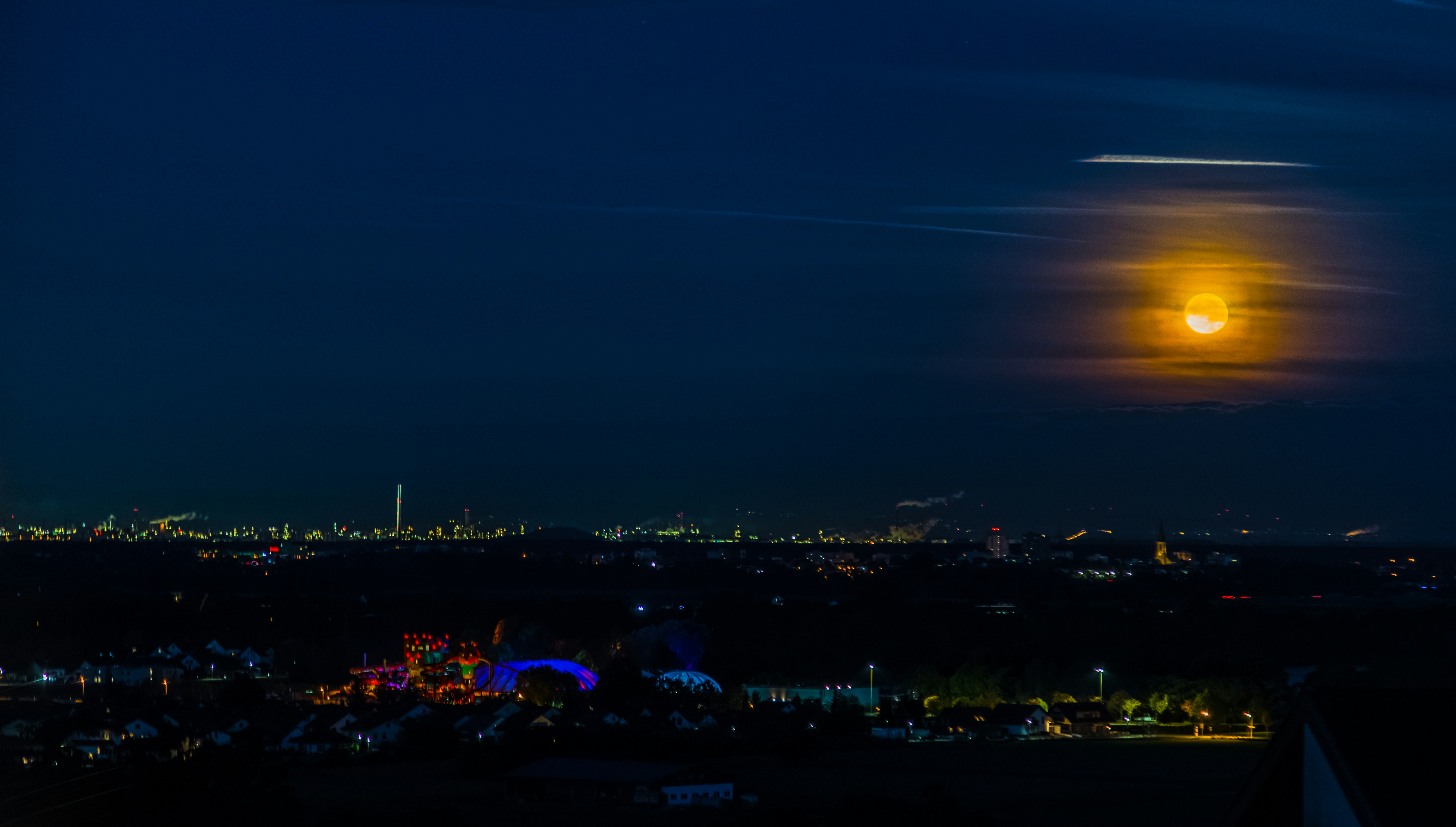 Moonglow Over the City: A Long-Exposure Nightscape of Lights