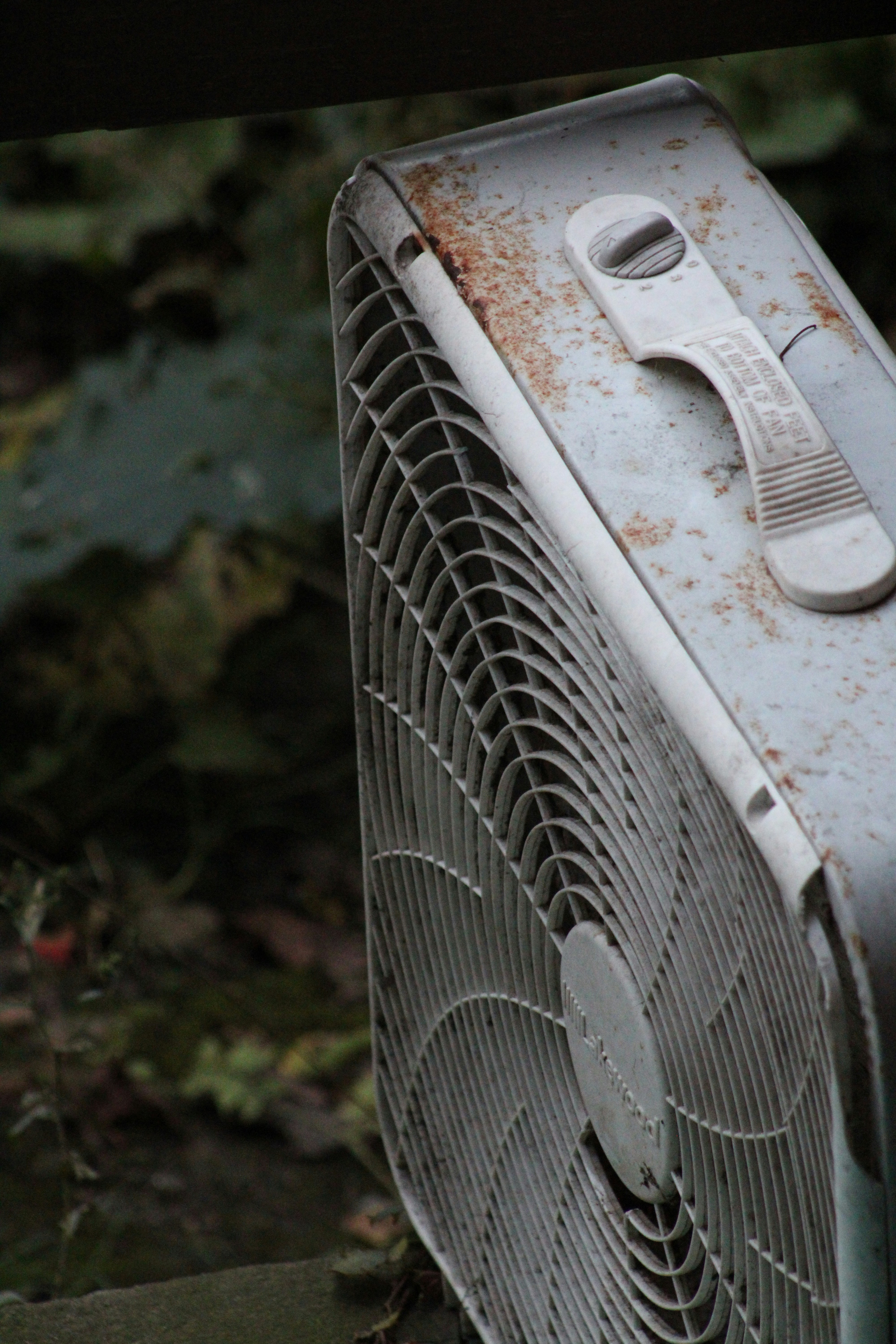 An old air conditioner sitting on the ground photo – Free Light Image ...