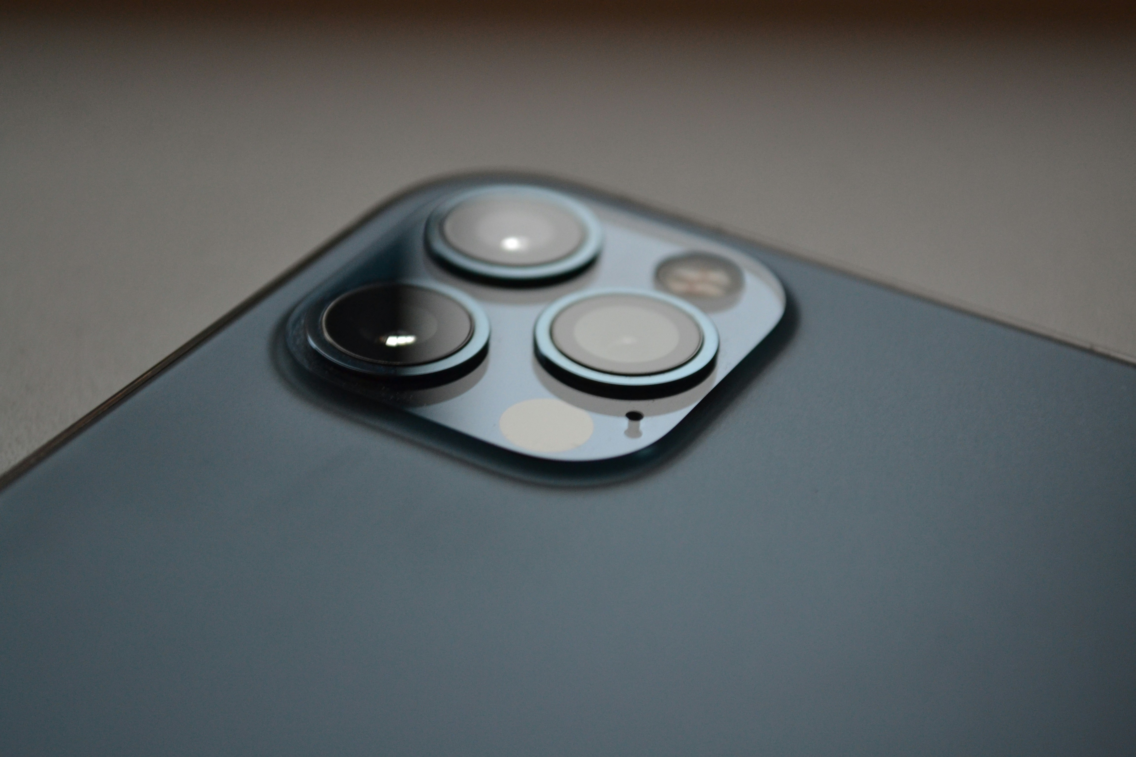 Close-up view of a smartphone's camera module showcasing its multiple lenses and sleek design.