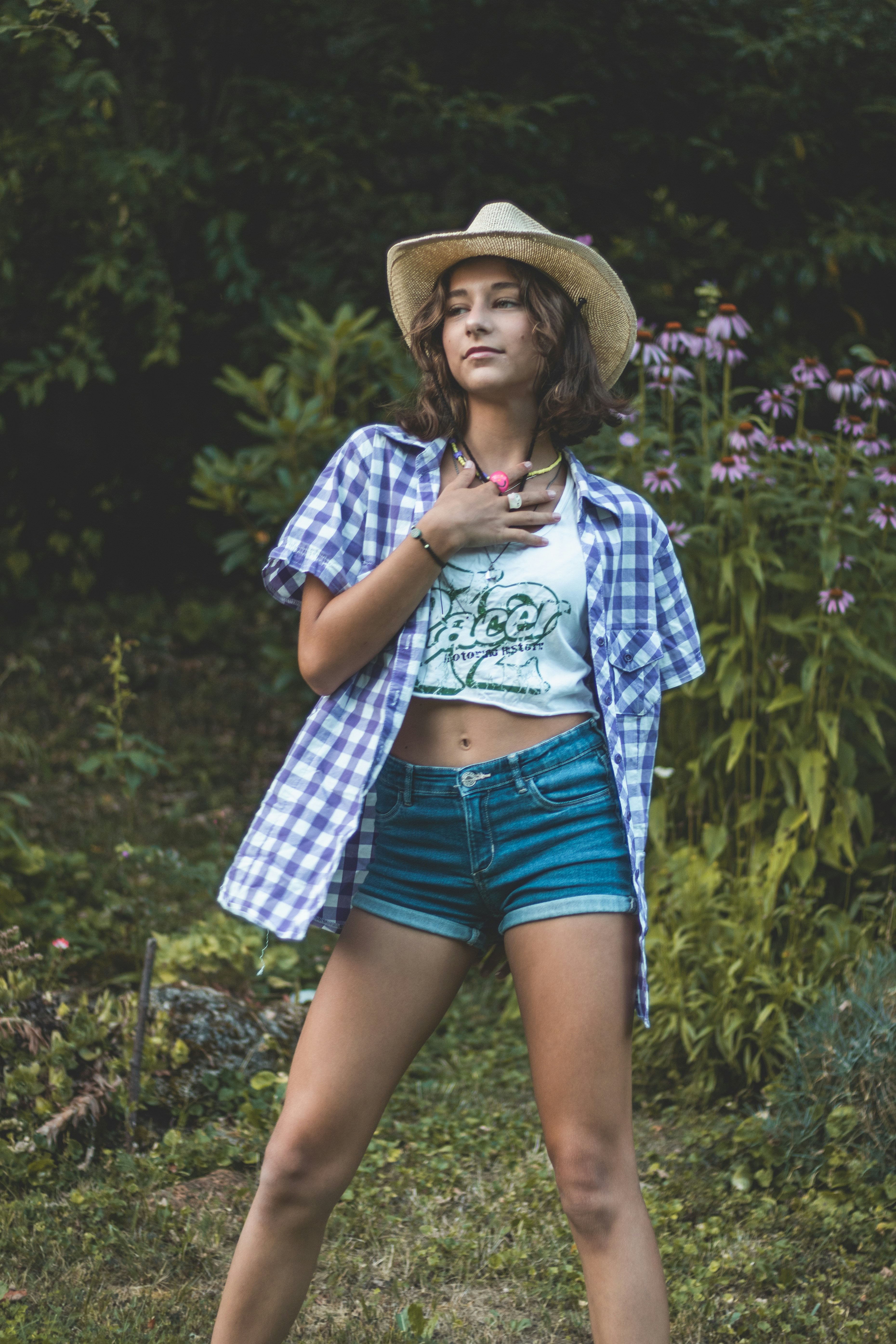 Garden Quietude: A Casual Portrait in Plaid and Straw Hat