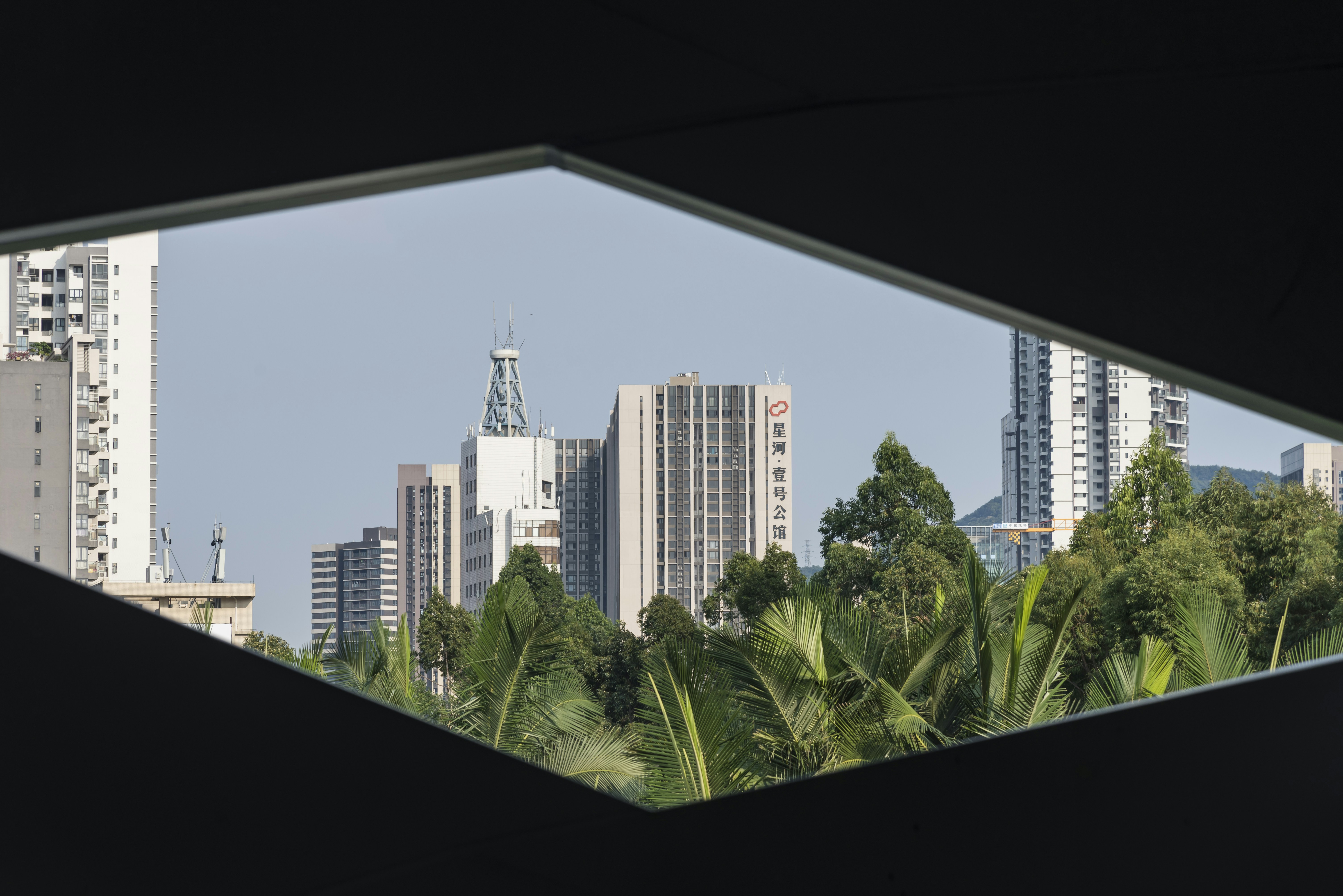 City Crest Framed by a Triangular Aperture