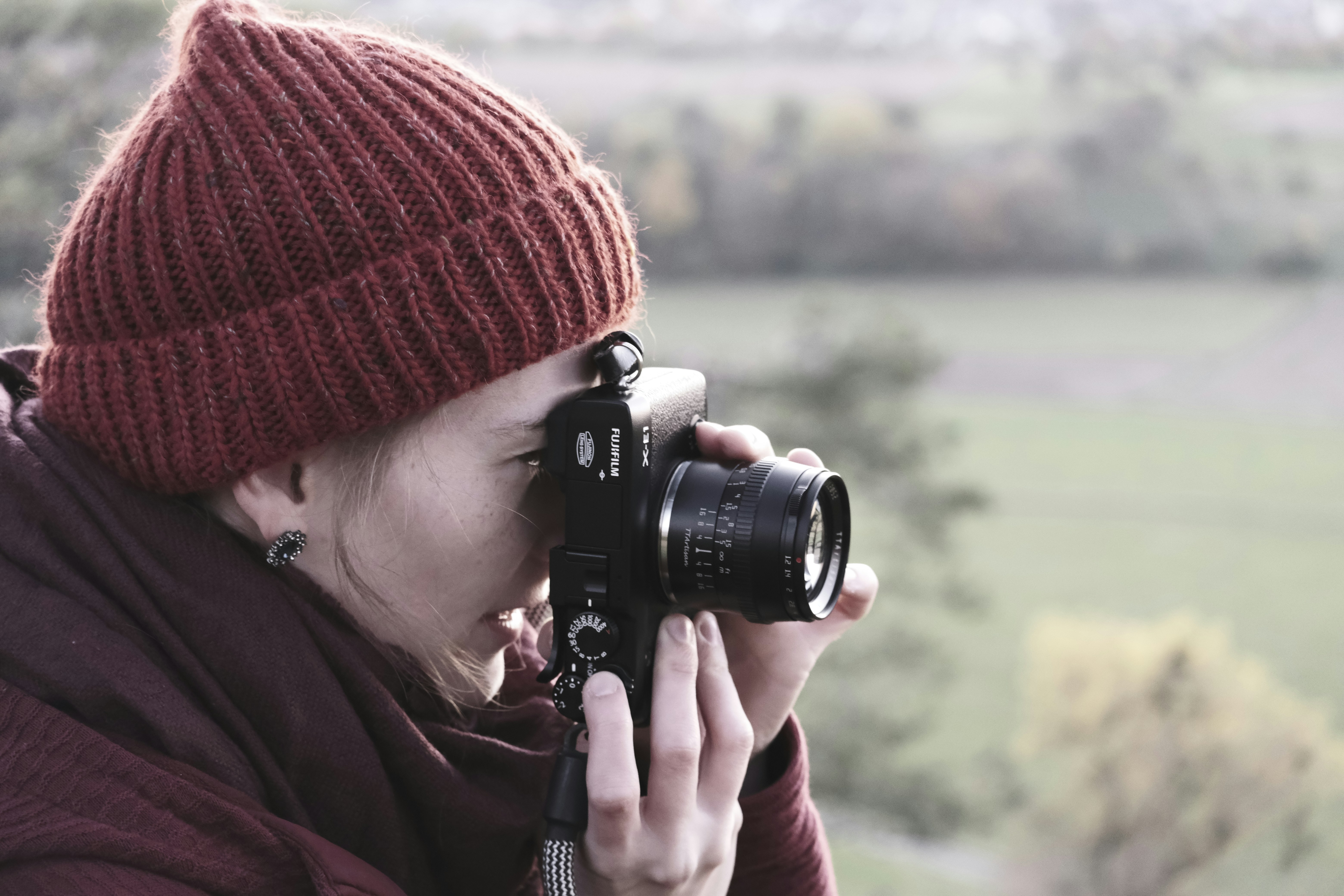 Red Knit Focus: A Photographer in Winter Light