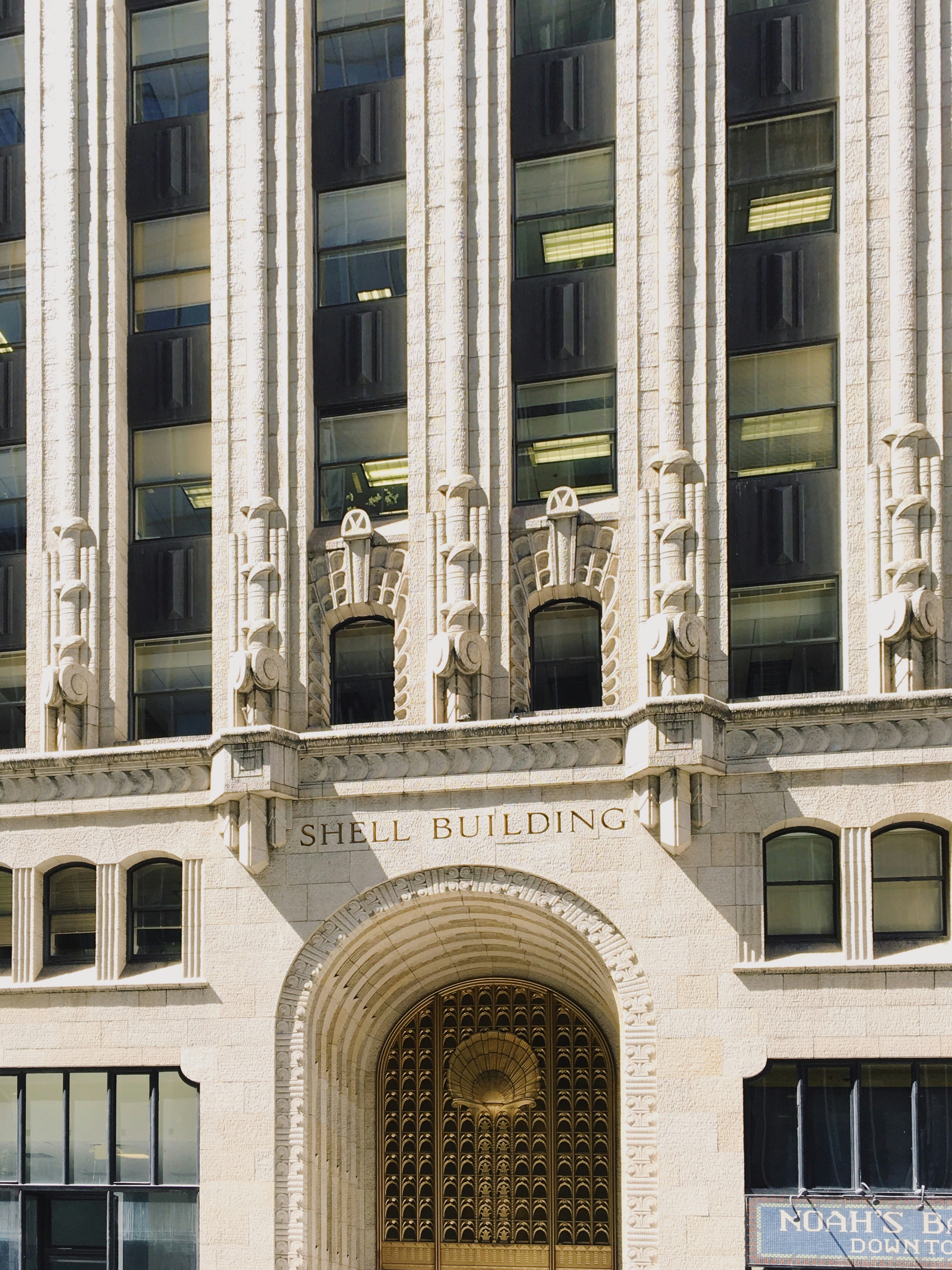 Grand Arch Portal: Ornate Stonework on the Shell Building
