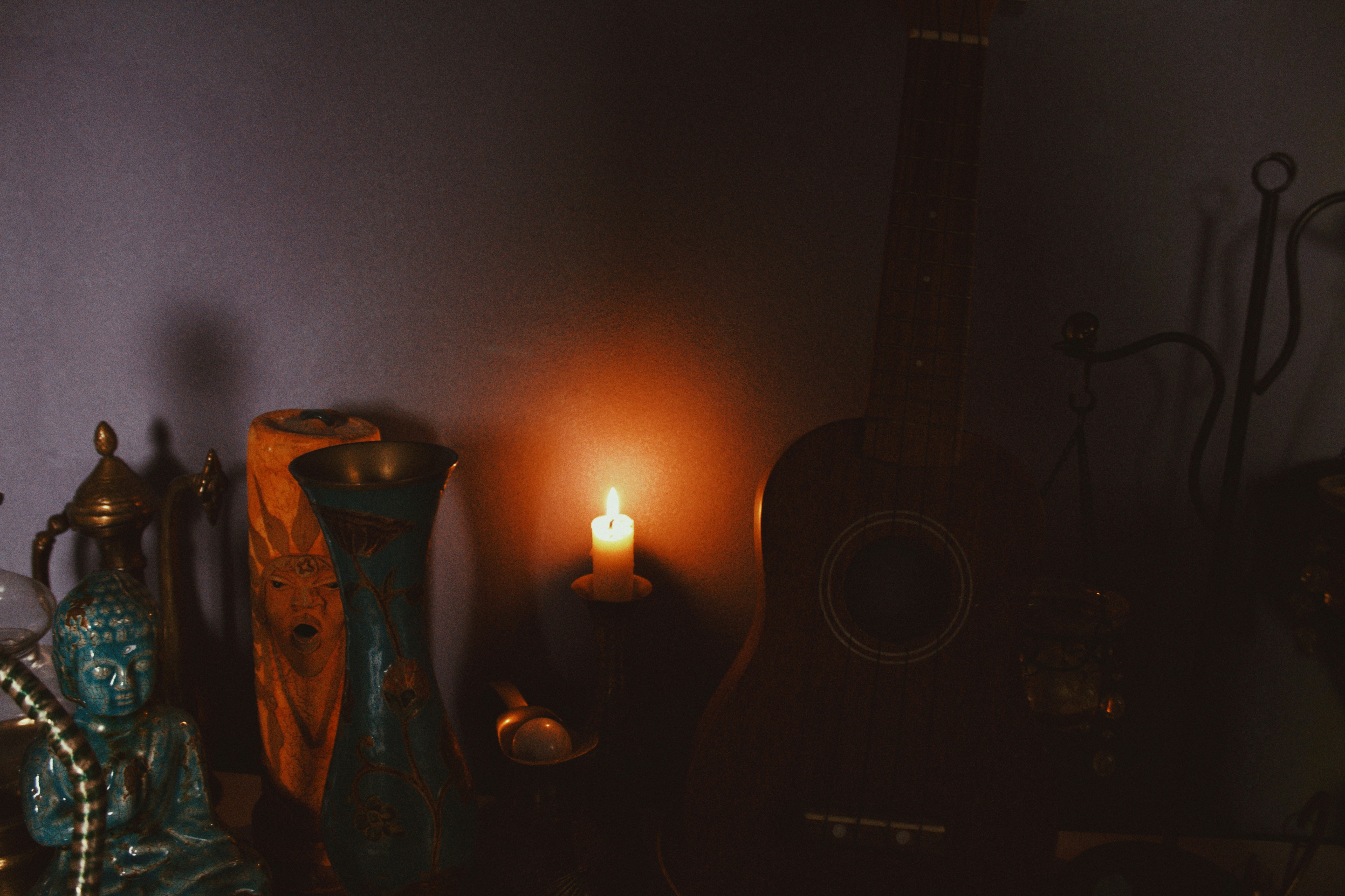 Muted Muse: A Candlelit Corner with a Guitar