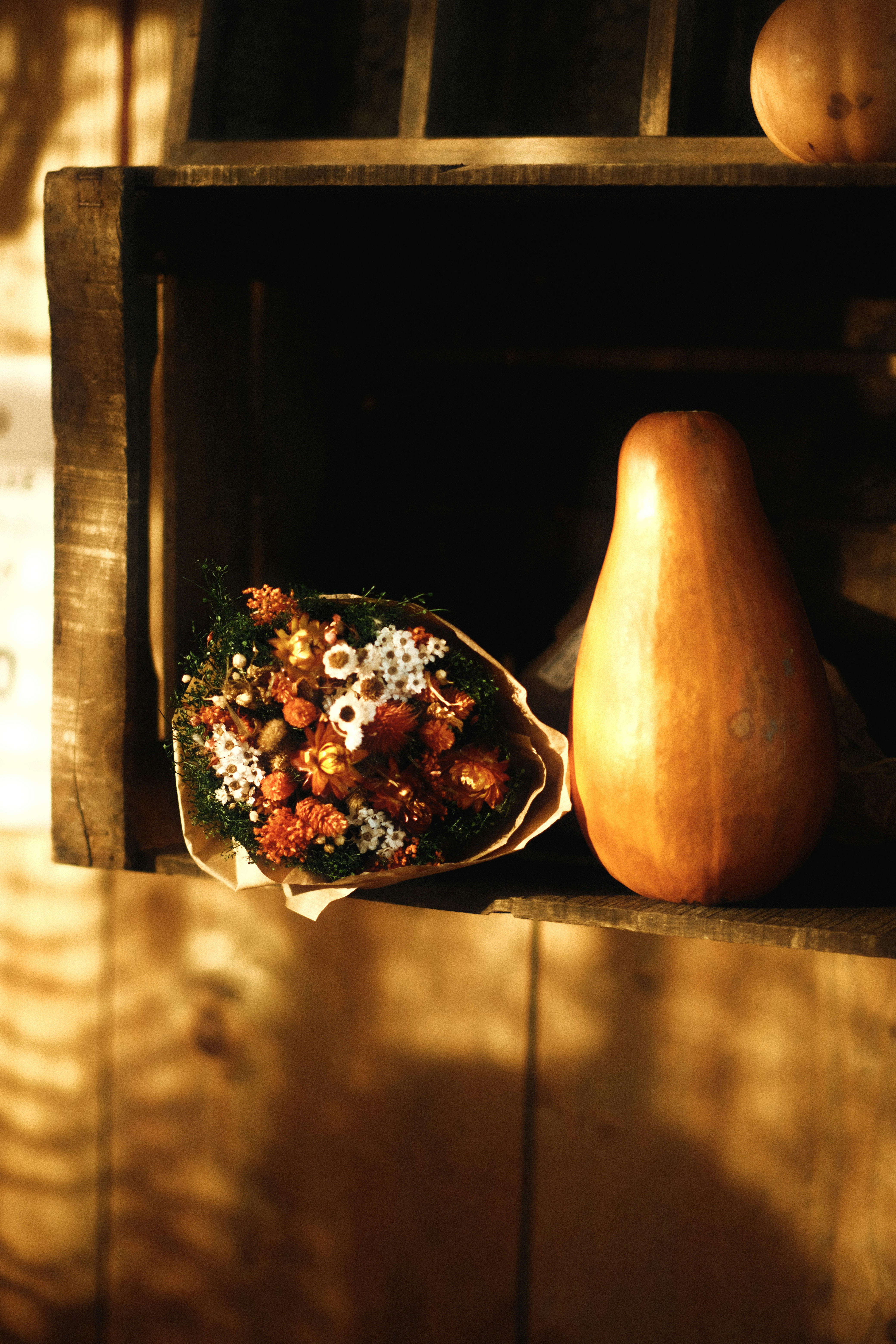 Amber Quiet: Bouquet and Squash on Weathered Wood