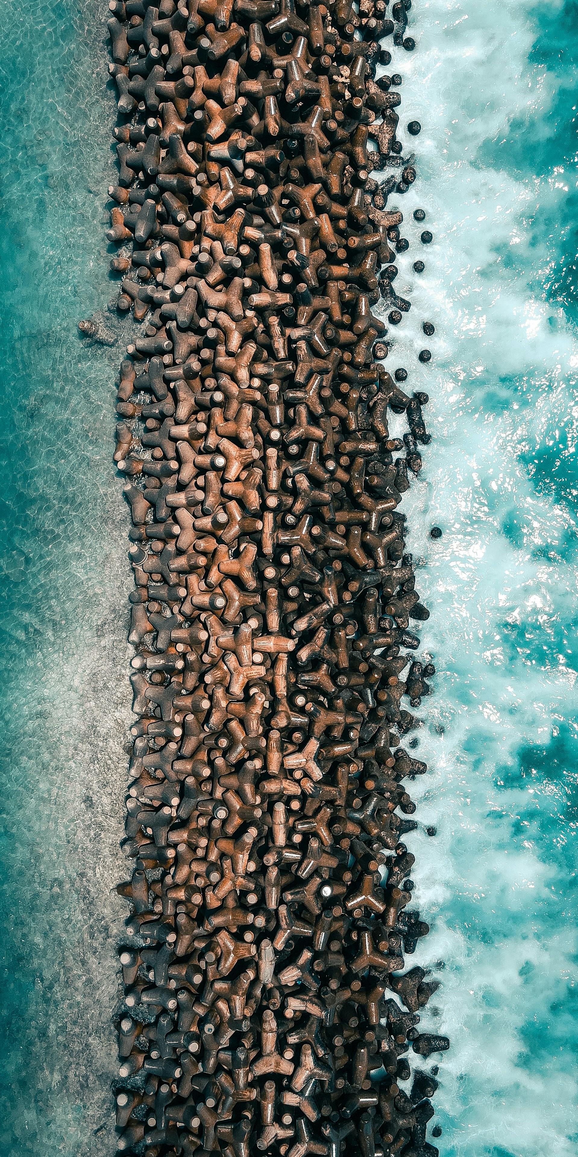 Stone Spine: Aerial Portrait of a Breakwater Dividing Turquoise Seas