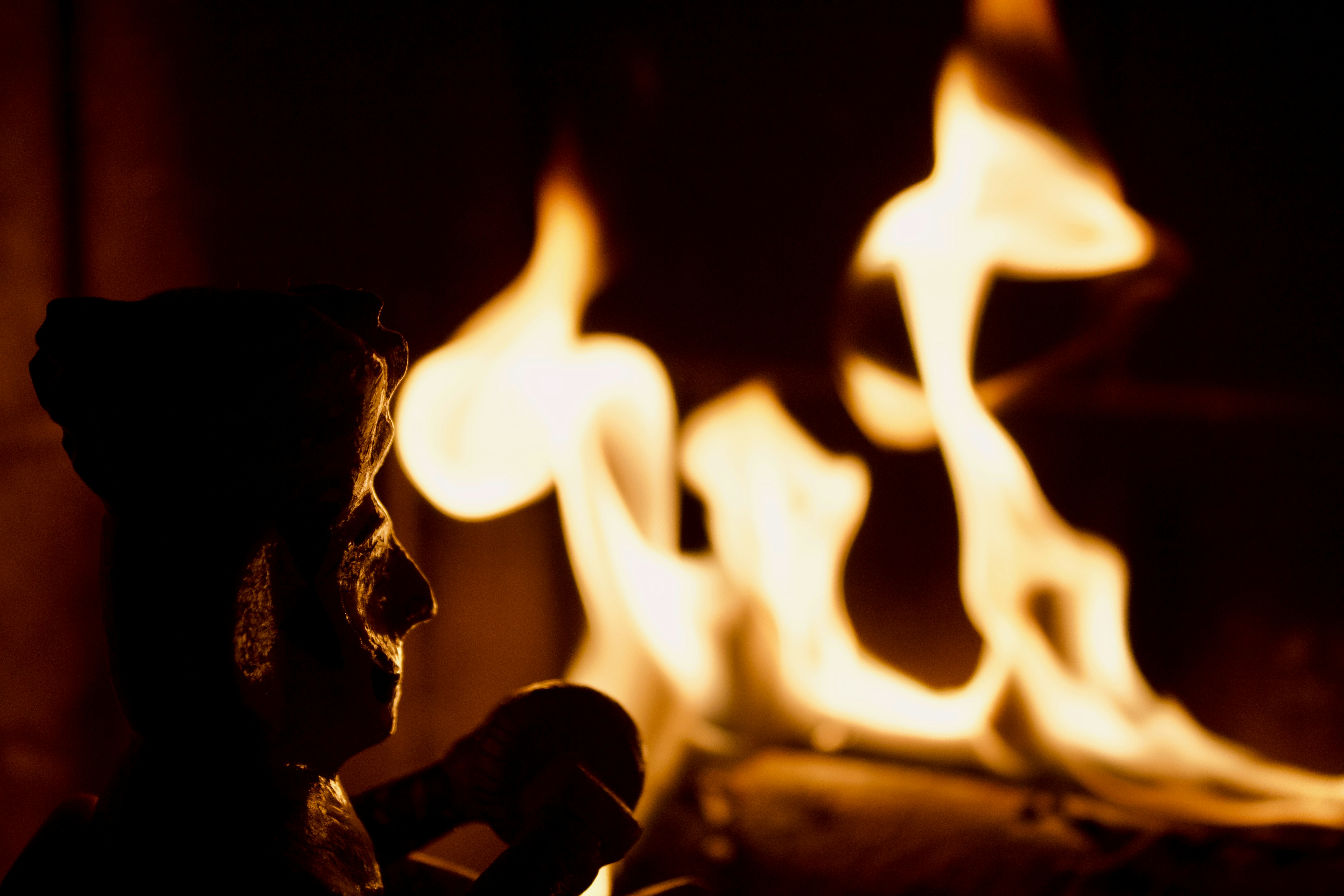 Hearthlight Silhouette: A Bust in Fire's Quiet Glow