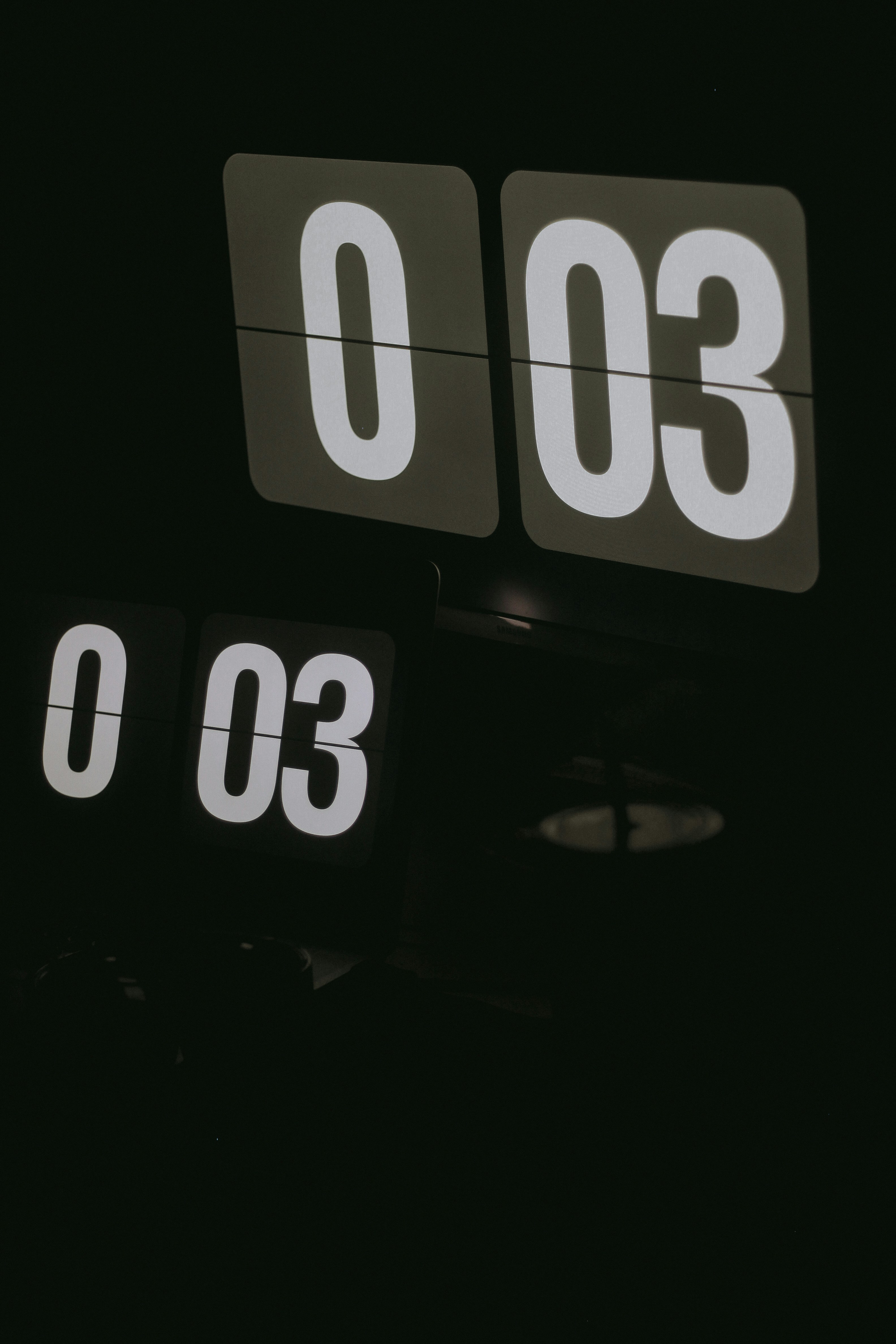 Noir Countdown: Neon Flip Digits Loom in the Dark