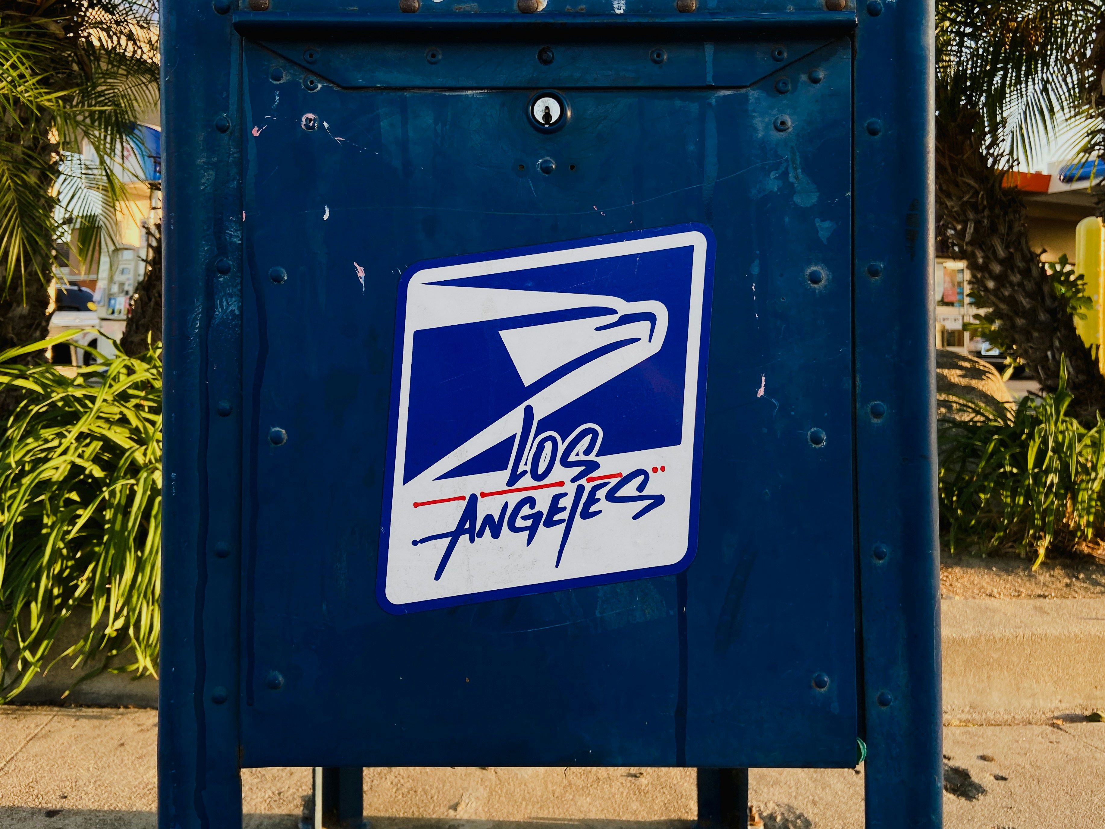 A blue mailbox with an air plane sticker on it photo – Free Los angeles ...