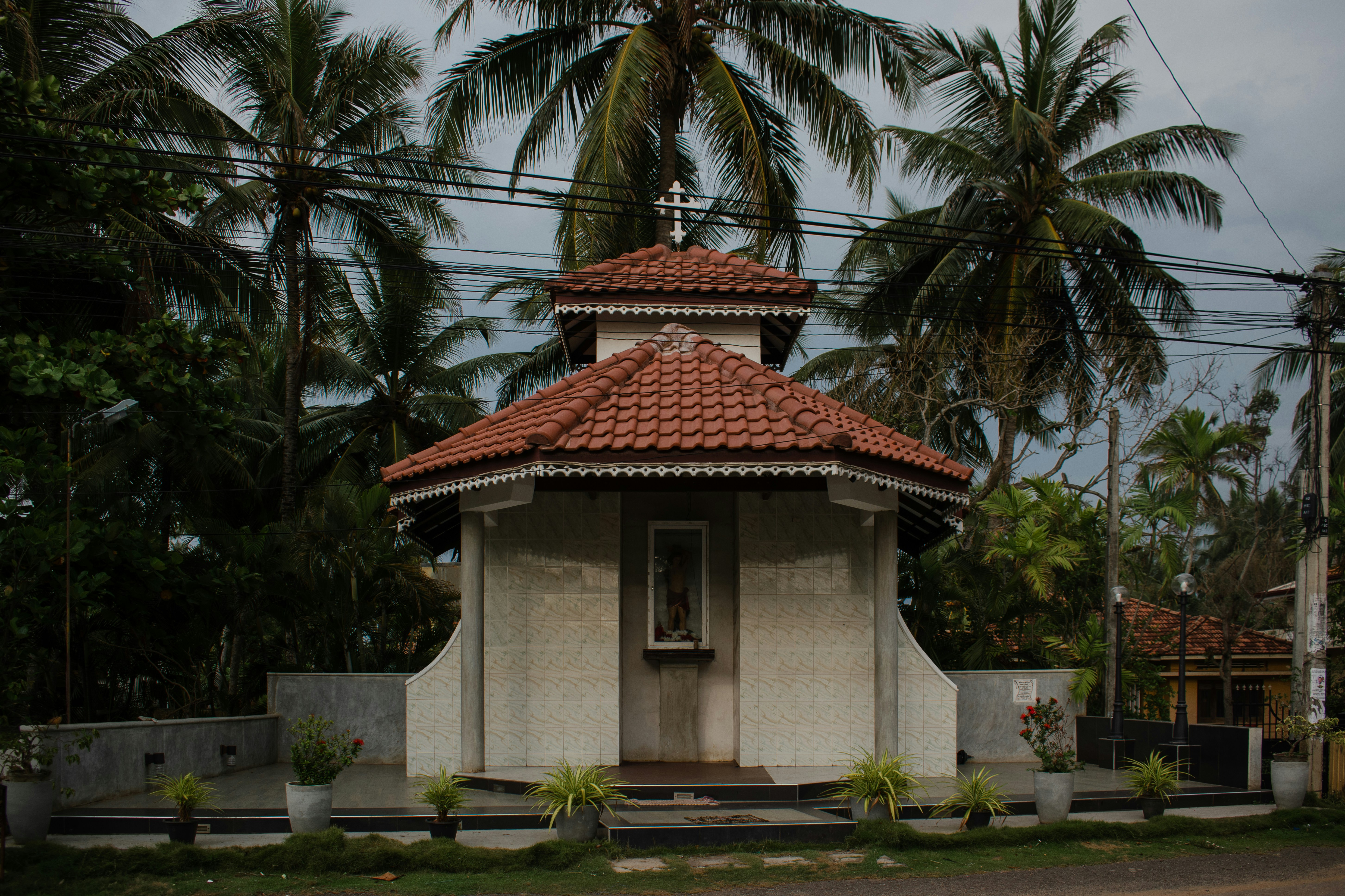 A small white building with a red roof photo – Free Building Image on ...